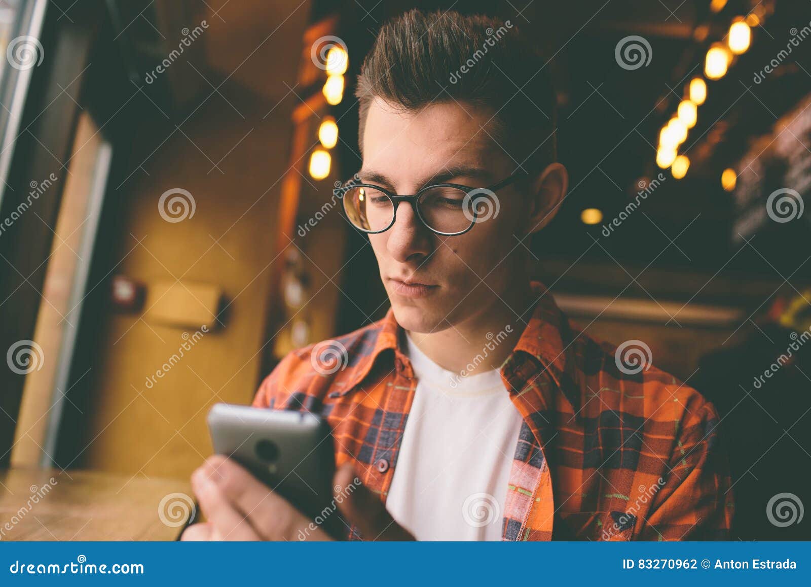 Close Up on the Hands of a Young Handsome Man Using Smartphone, Tapping ...