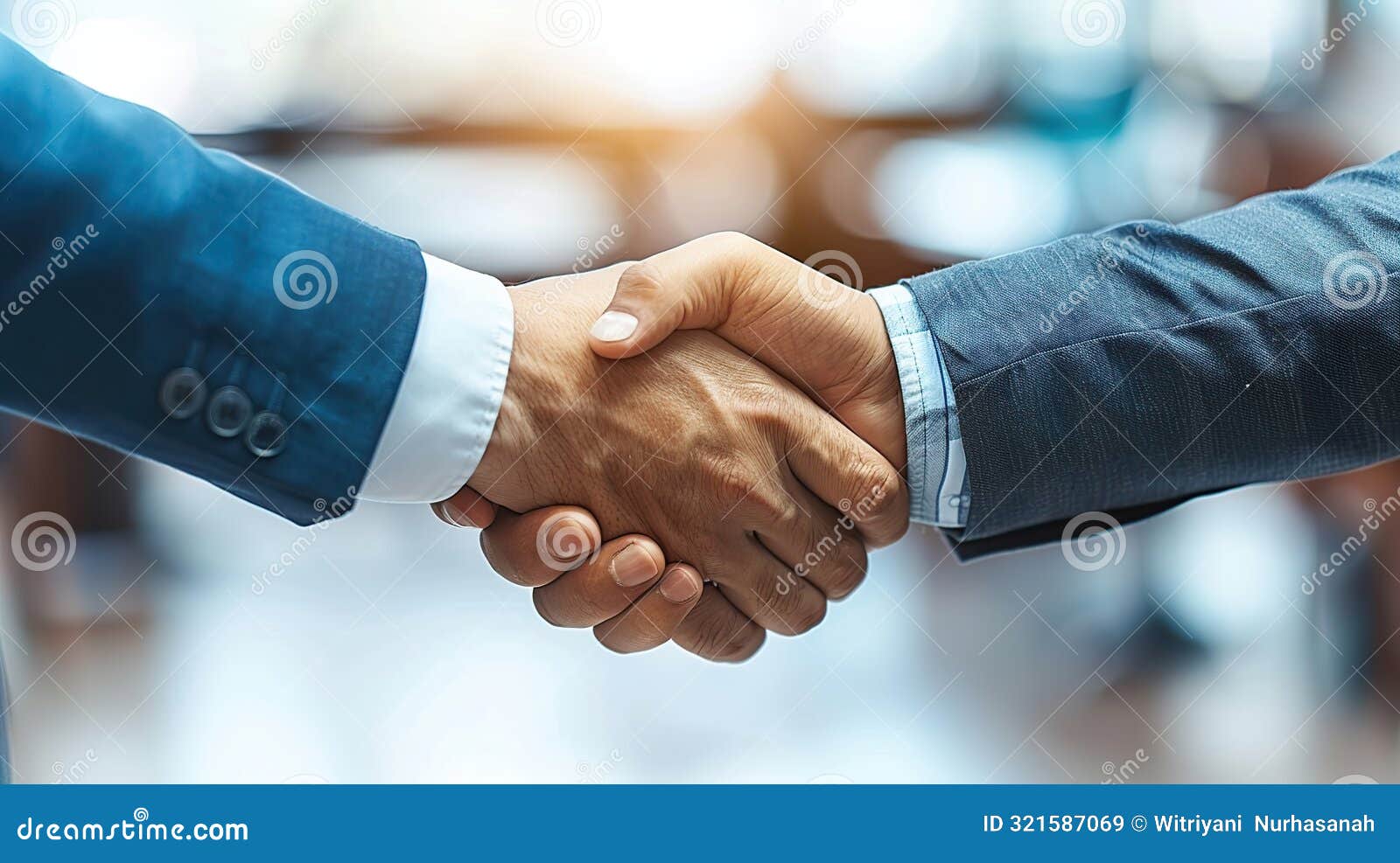 Close-up Of Two Businessmen Shaking Hands In Office. Business Concept ...