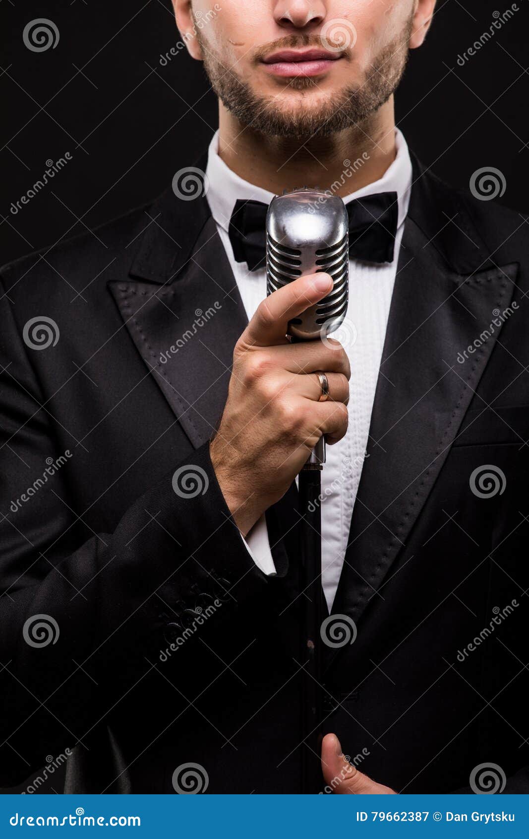 Close Up Handsome Man In Suit Singing With The Microphone And Smile