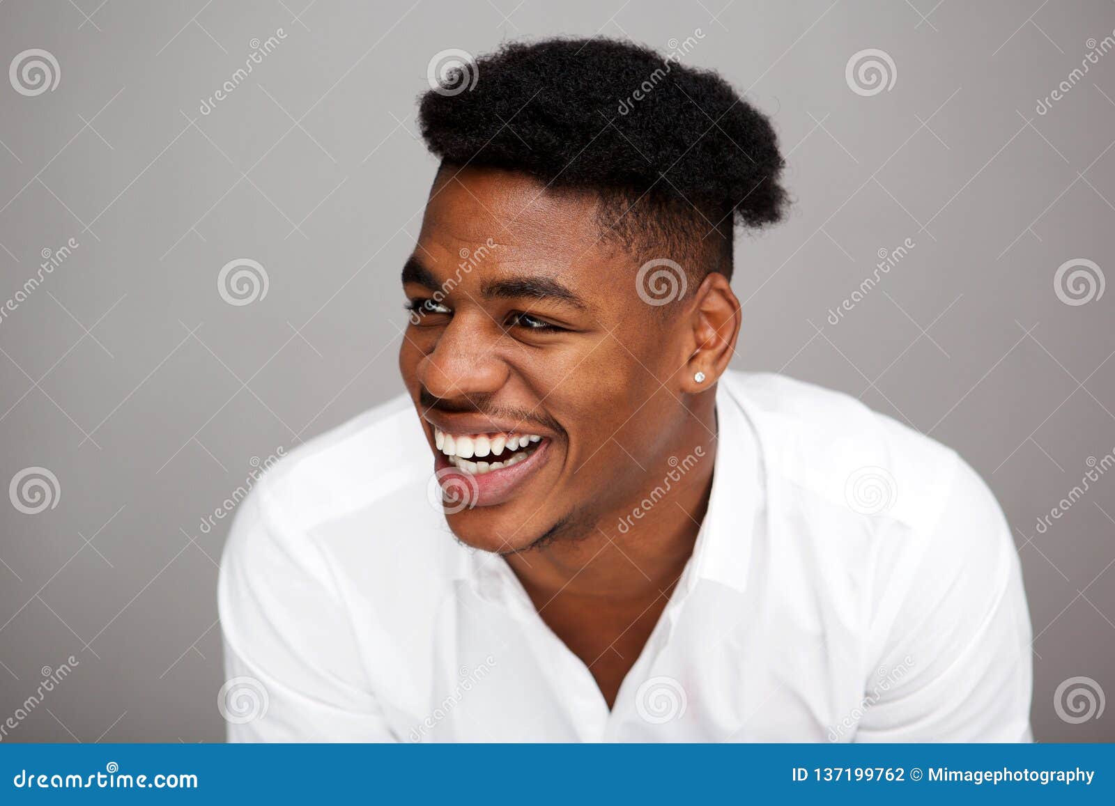 Close Up Handsome Young African American Man Laughing And Looking Away