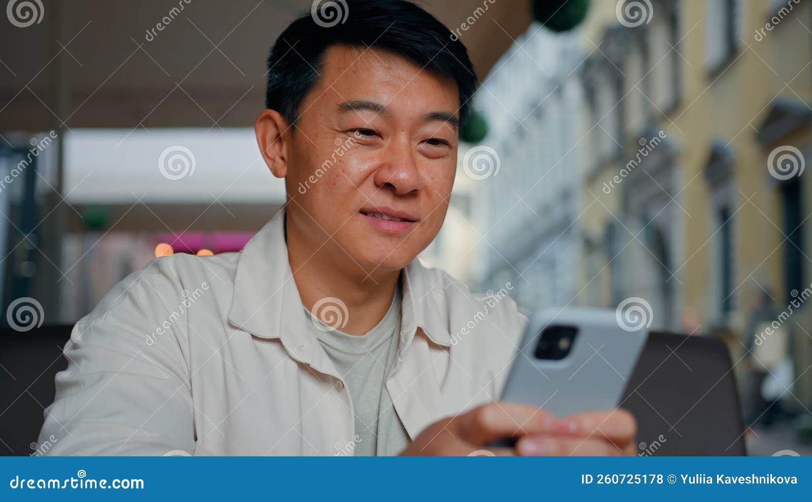 Close Up Happy Asian Man Holding Mobile Phone Browsing Social Network