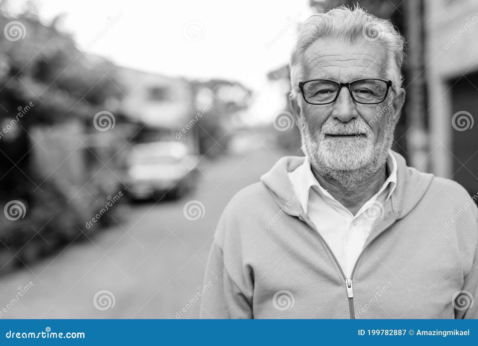 Close Up Of Happy Handsome Senior Bearded Man Smiling While Wearing
