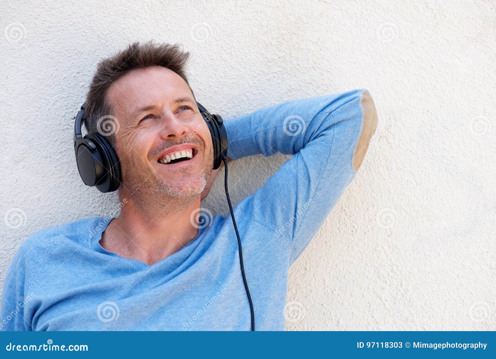 Close Up Happy Man With Headphones Listening To Music Stock Image