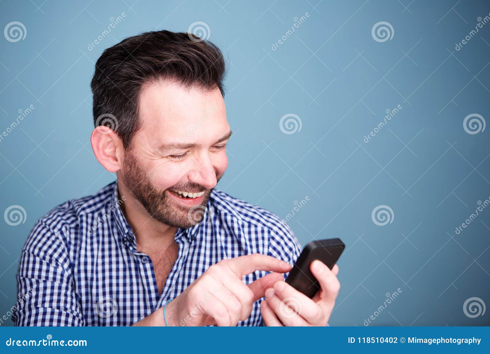 Close Up Happy Man Looking at Text Message on Cellphone Stock Photo ...