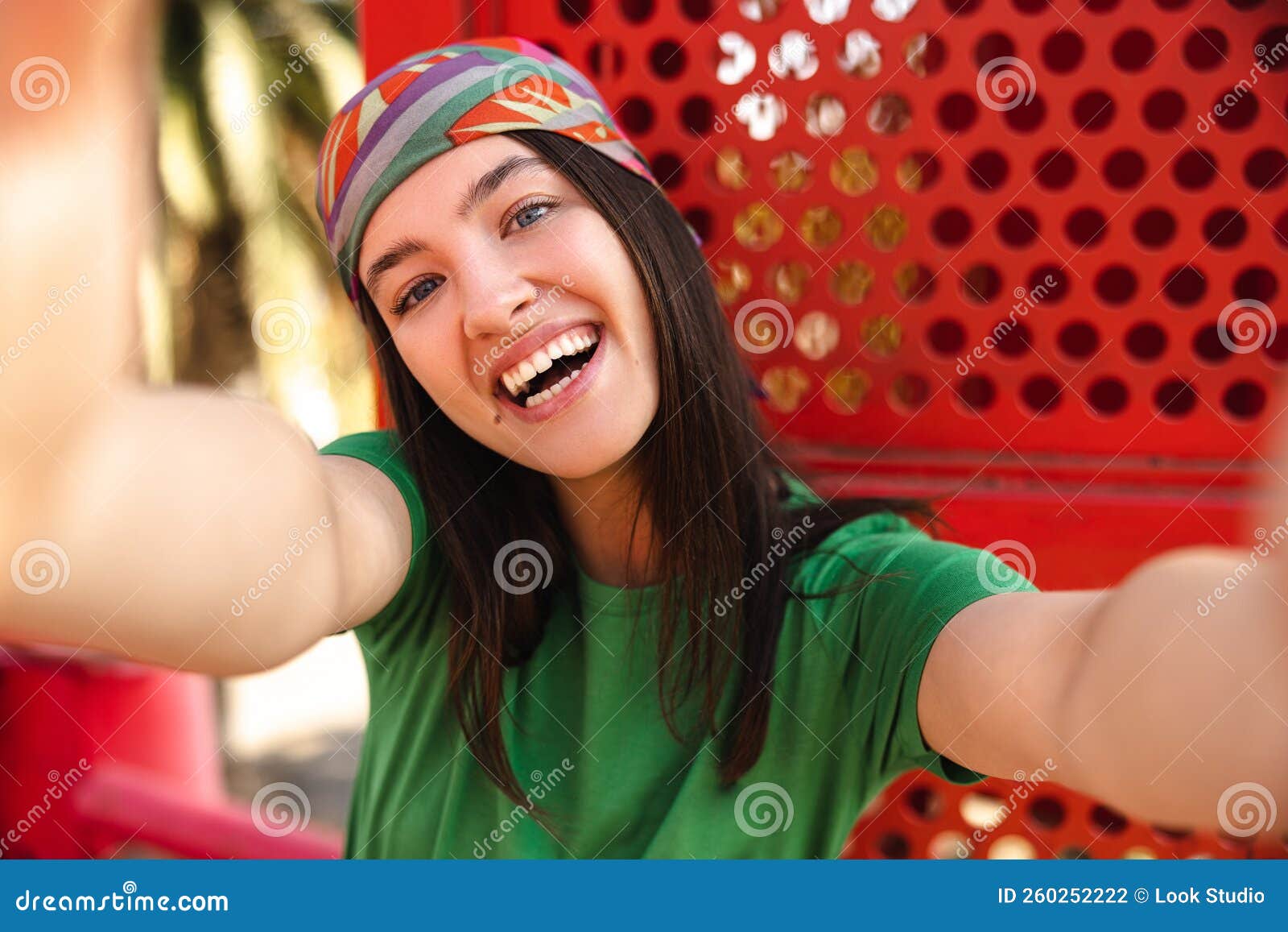 Close Up Of Happy Young Caucasian Girl Smiling With Teeth Looking At