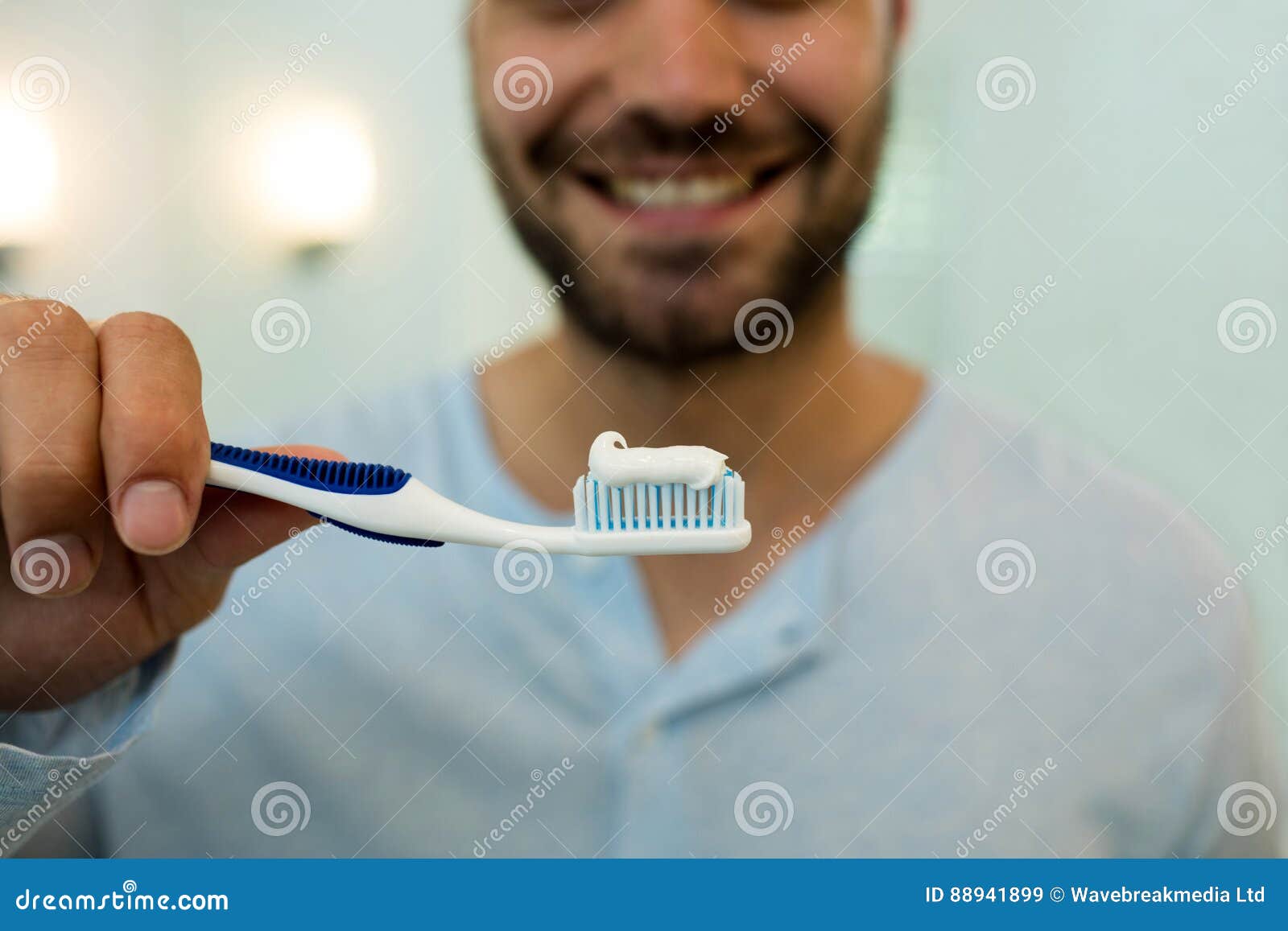Close-up of Happy Young Man Holding Toothbrush with Toothpaste Stock ...