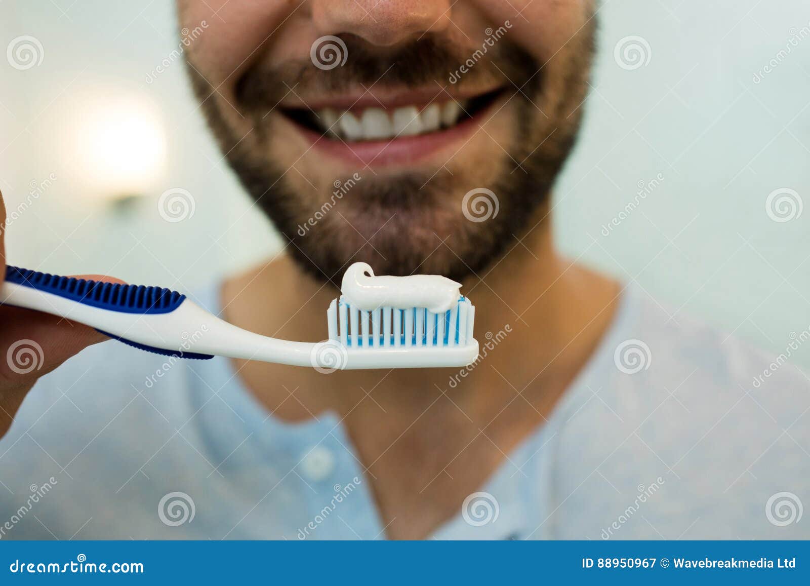 Close-up of Happy Young Man Holding Toothbrush with Toothpaste Stock ...