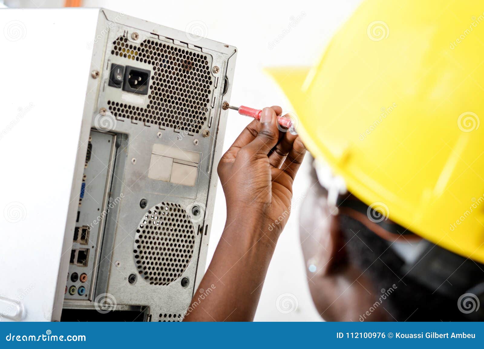 Close-up of the Head of a Worker Opening a Computer. Stock Photo ...