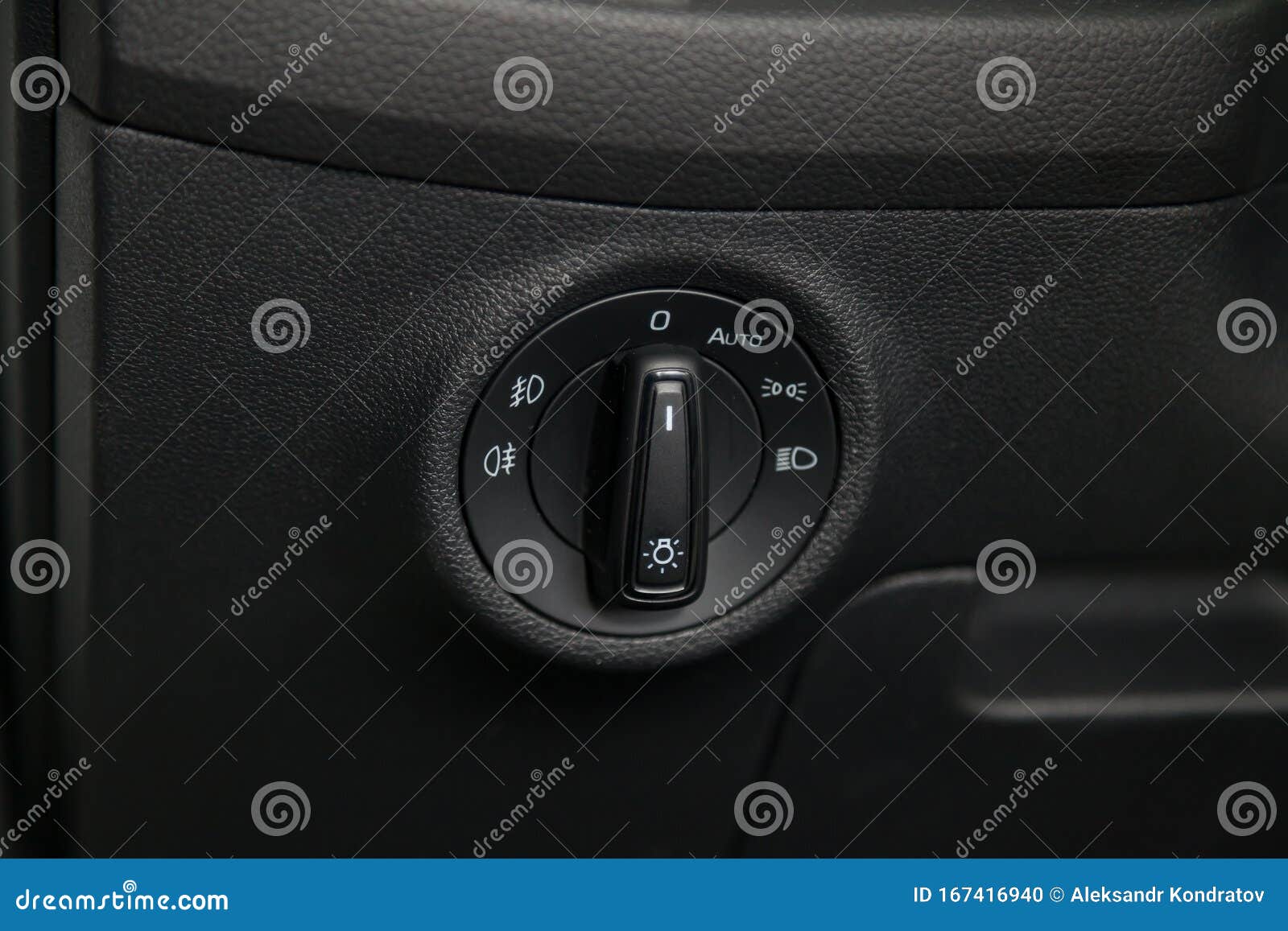 Close-up on the Headlight Switch Control Buttons and Automatic Adjust ...