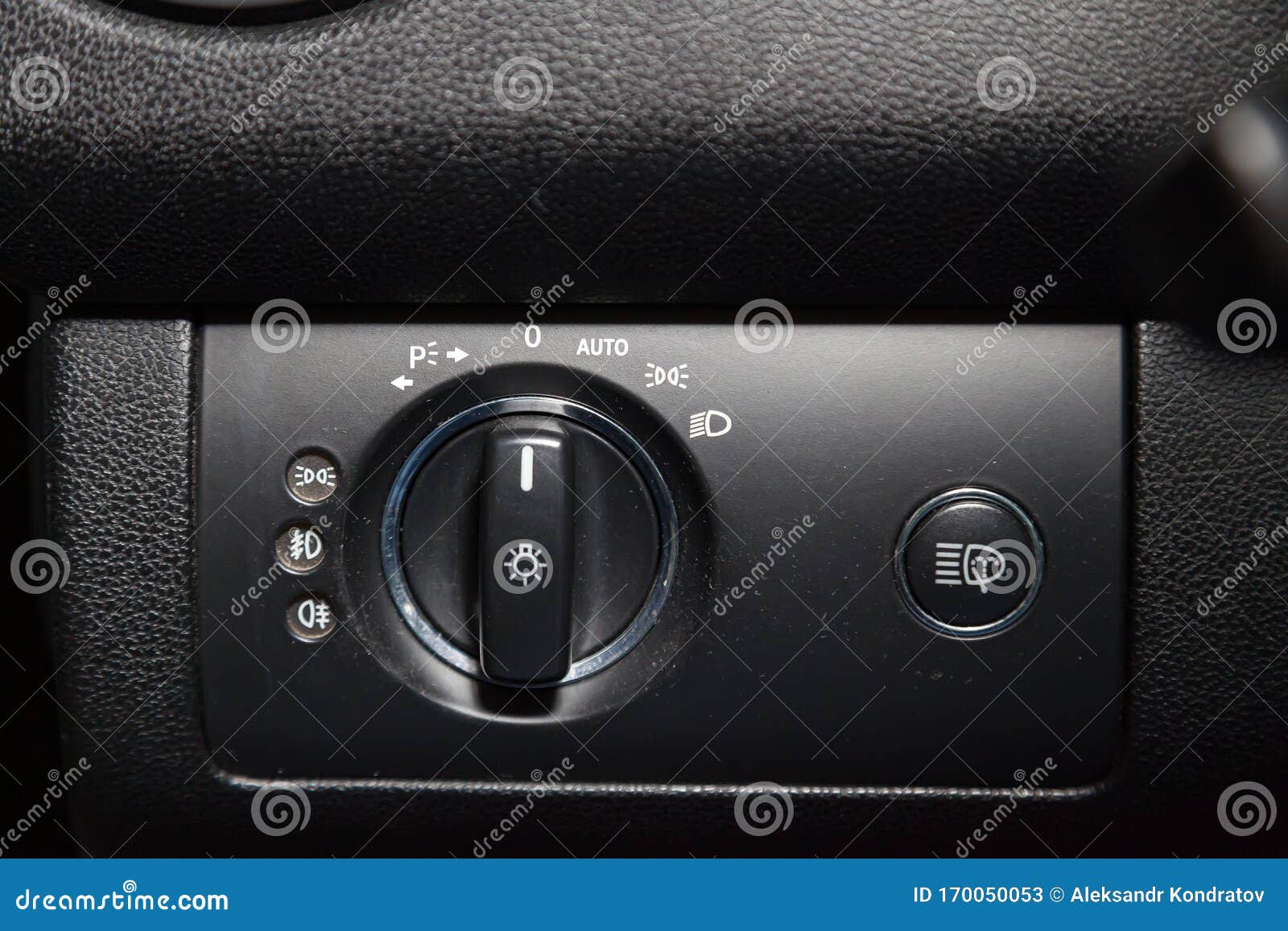 Close-up on the Headlight Switch Control Buttons and Automatic Adjust ...