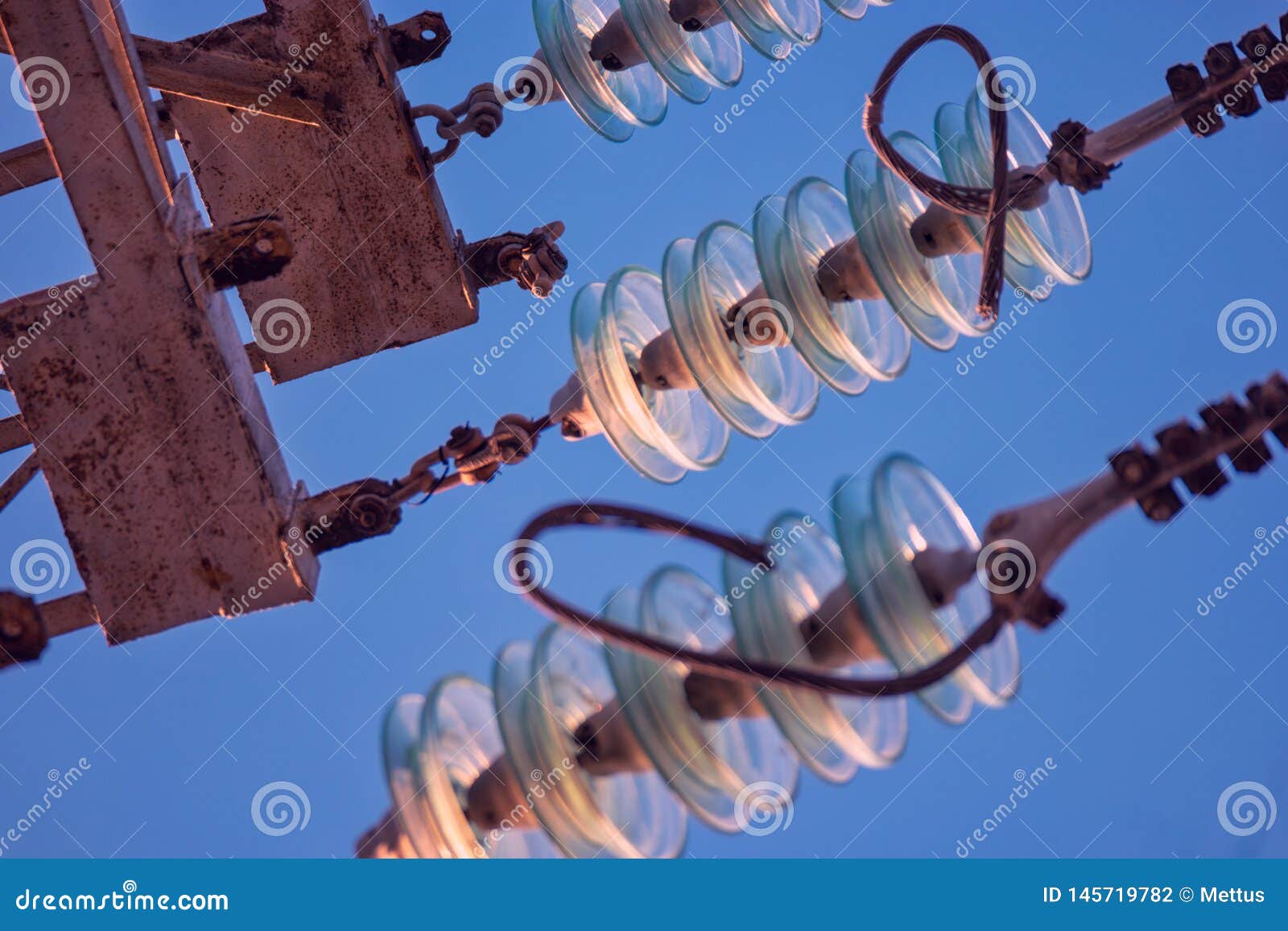Close Up of High Voltage Insulators at Power-tower Stock Photo - Image ...