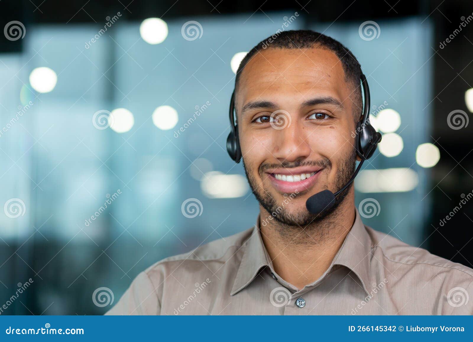 Close Up Hispanic Male Worker with Video Headset Smiling and Looking at ...