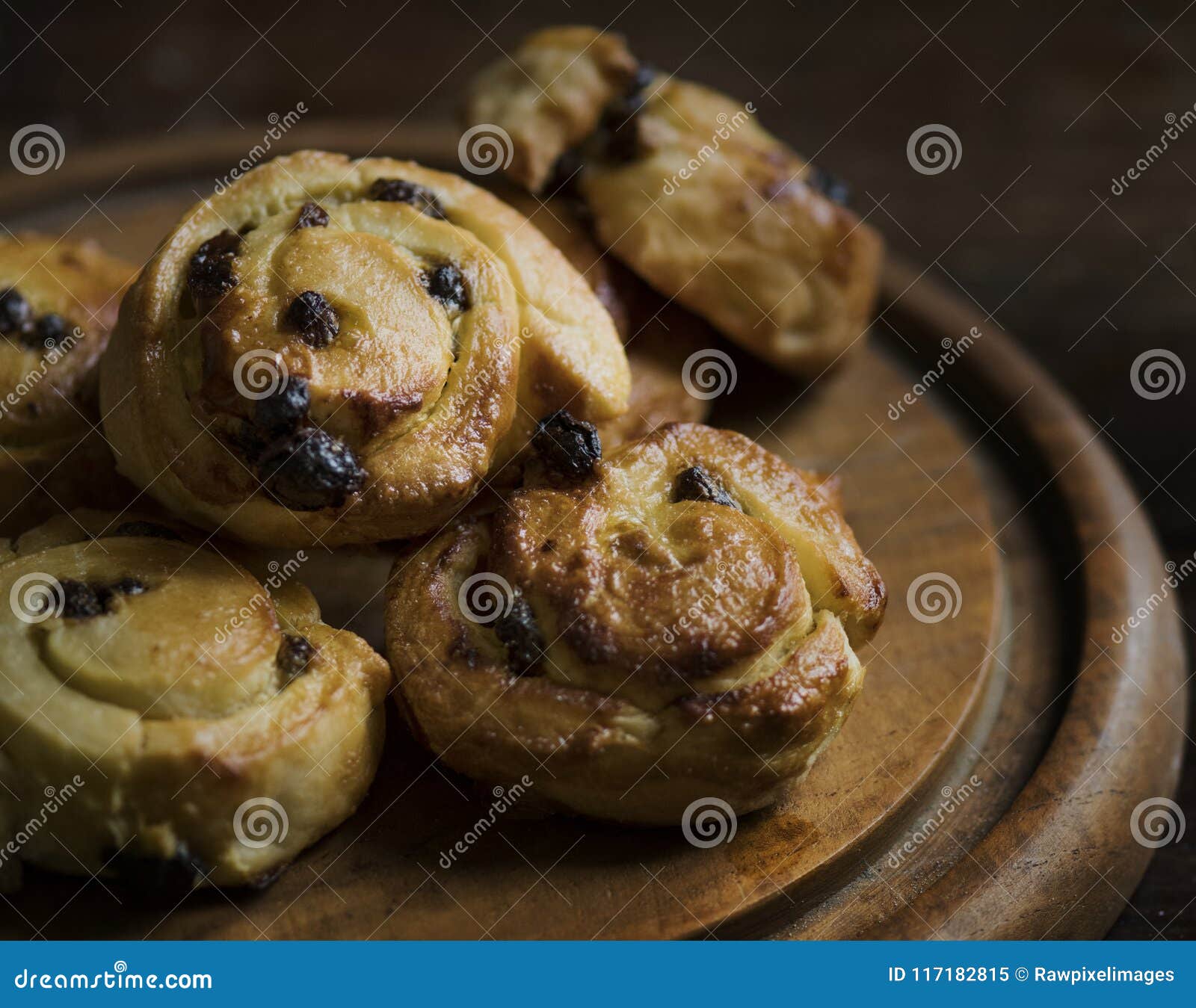 Close Up of Homemade Raisin Bun Stock Image - Image of flying, blue ...