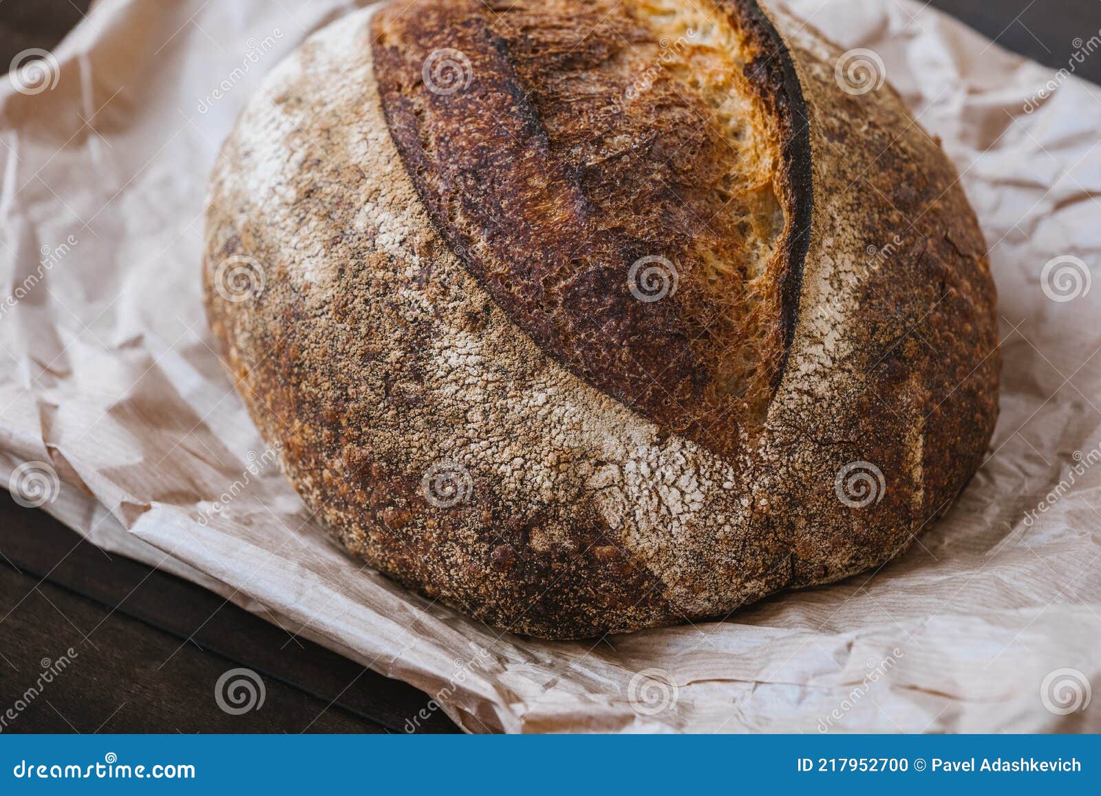 Close-up Hot Rye Circle Bread with Crispy Crust on a Craft Package ...
