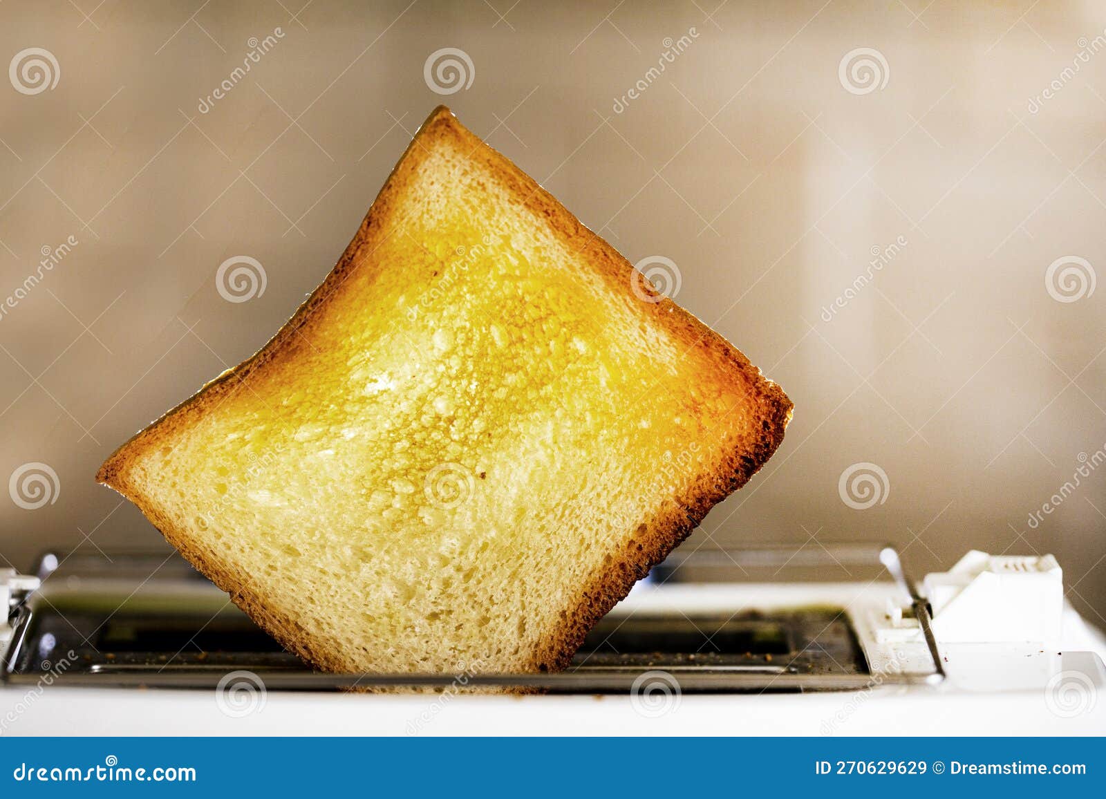 Close-up of a Hot Slice of Toasted White Bread in a Toaster in the ...