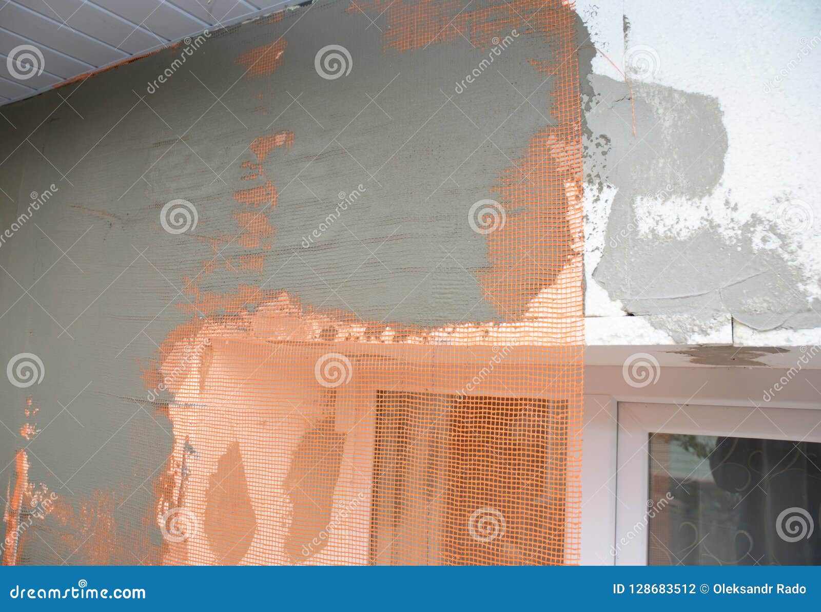 Man Plastering A Wall Using Floating Rule To Check The Flatness Stock ...