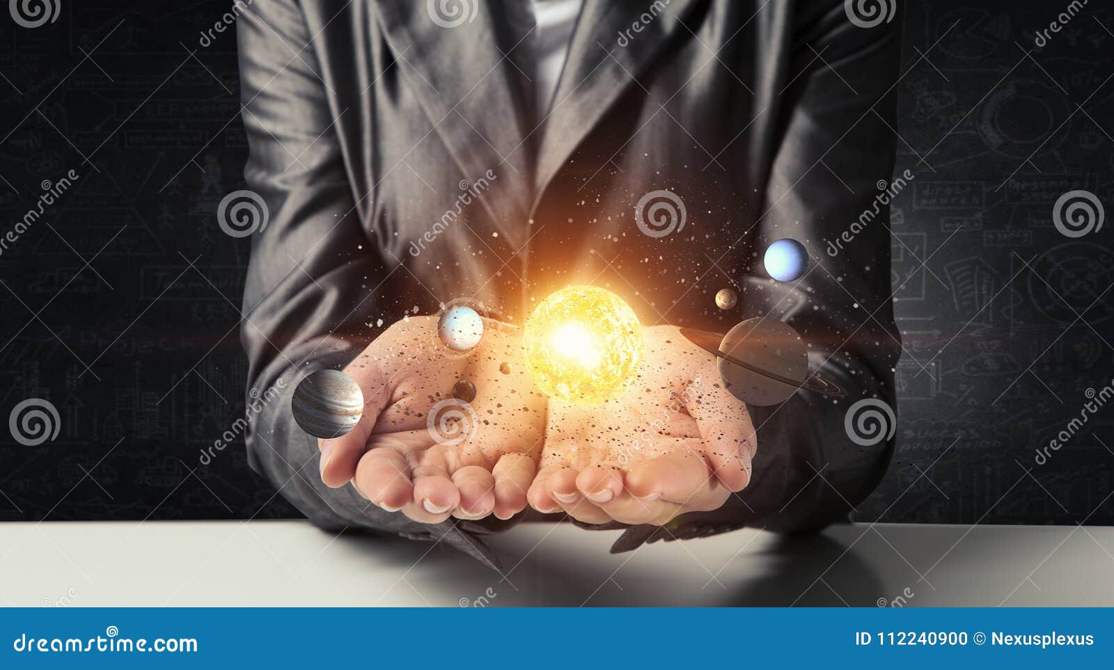 Solar system in hands stock photo. Image of hand, glowing - 112240900