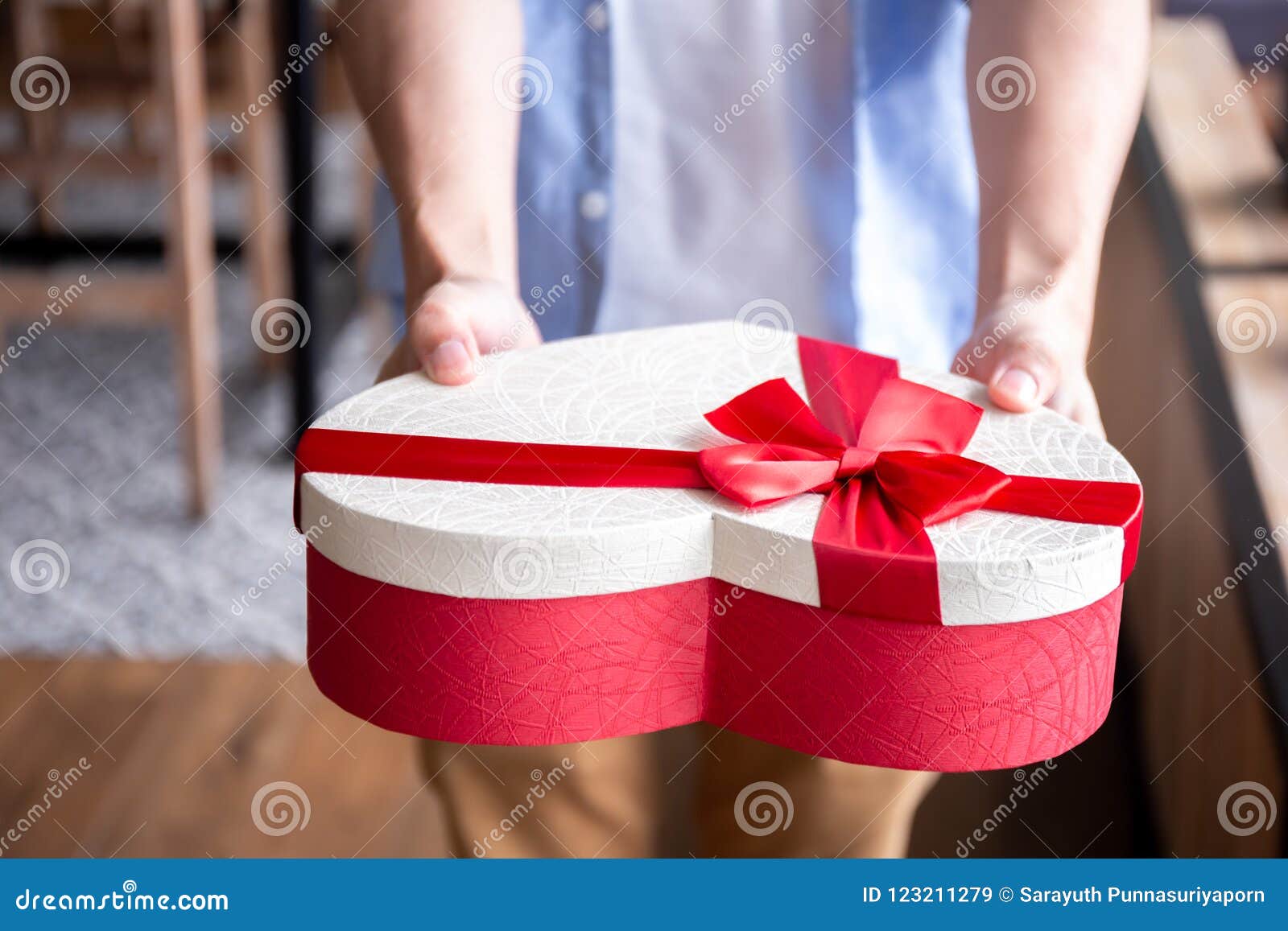 Close Up of Human Hands Receiving a Decorative Present Gift with Stock ...