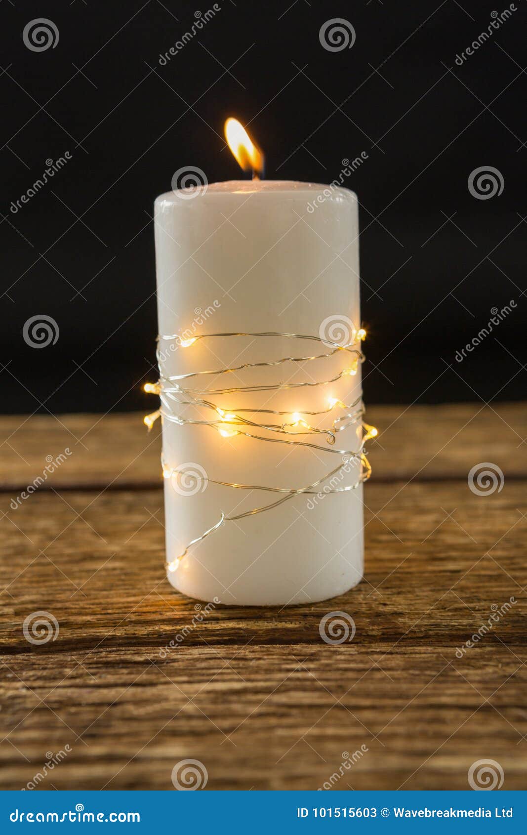 Close Up of Illuminated String Lights Wrapped on Lit Candle Stock Image ...