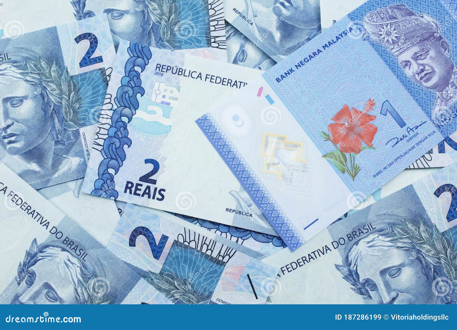 A Malaysian Ringgit on a Background of Brazilian Two Reais Bank Notes ...