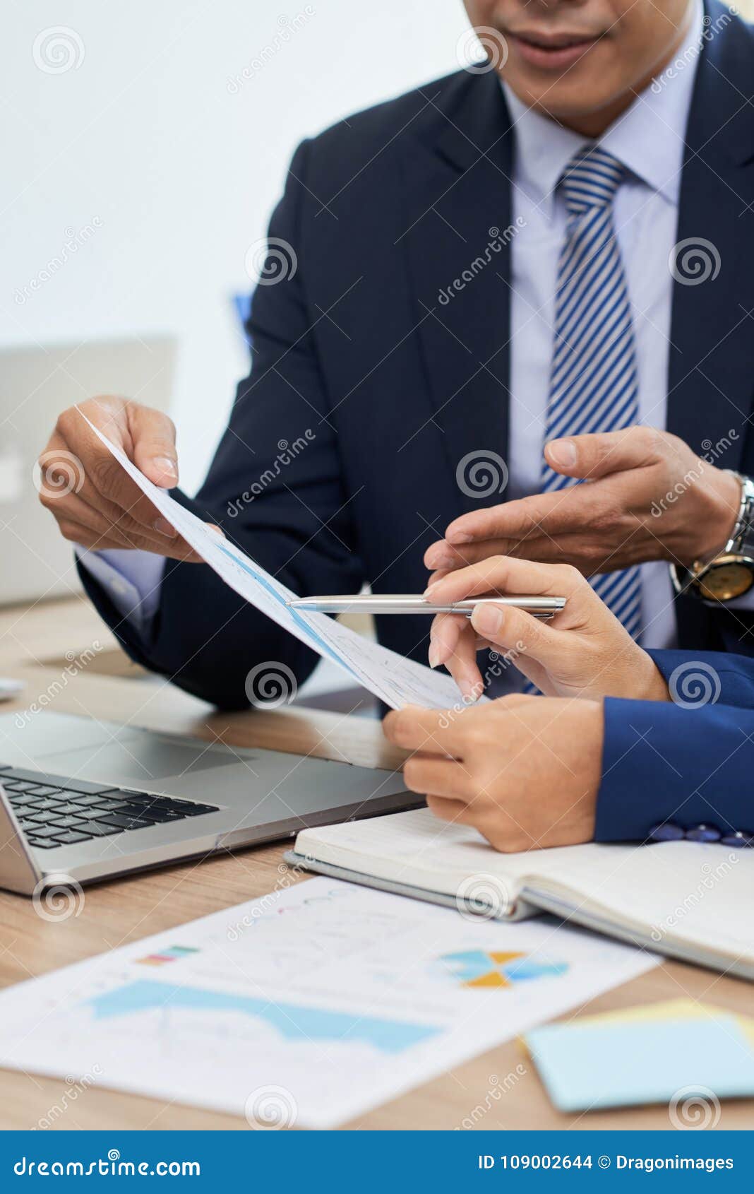 Analyzing reports stock photo. Image of executive, discussing - 109002644