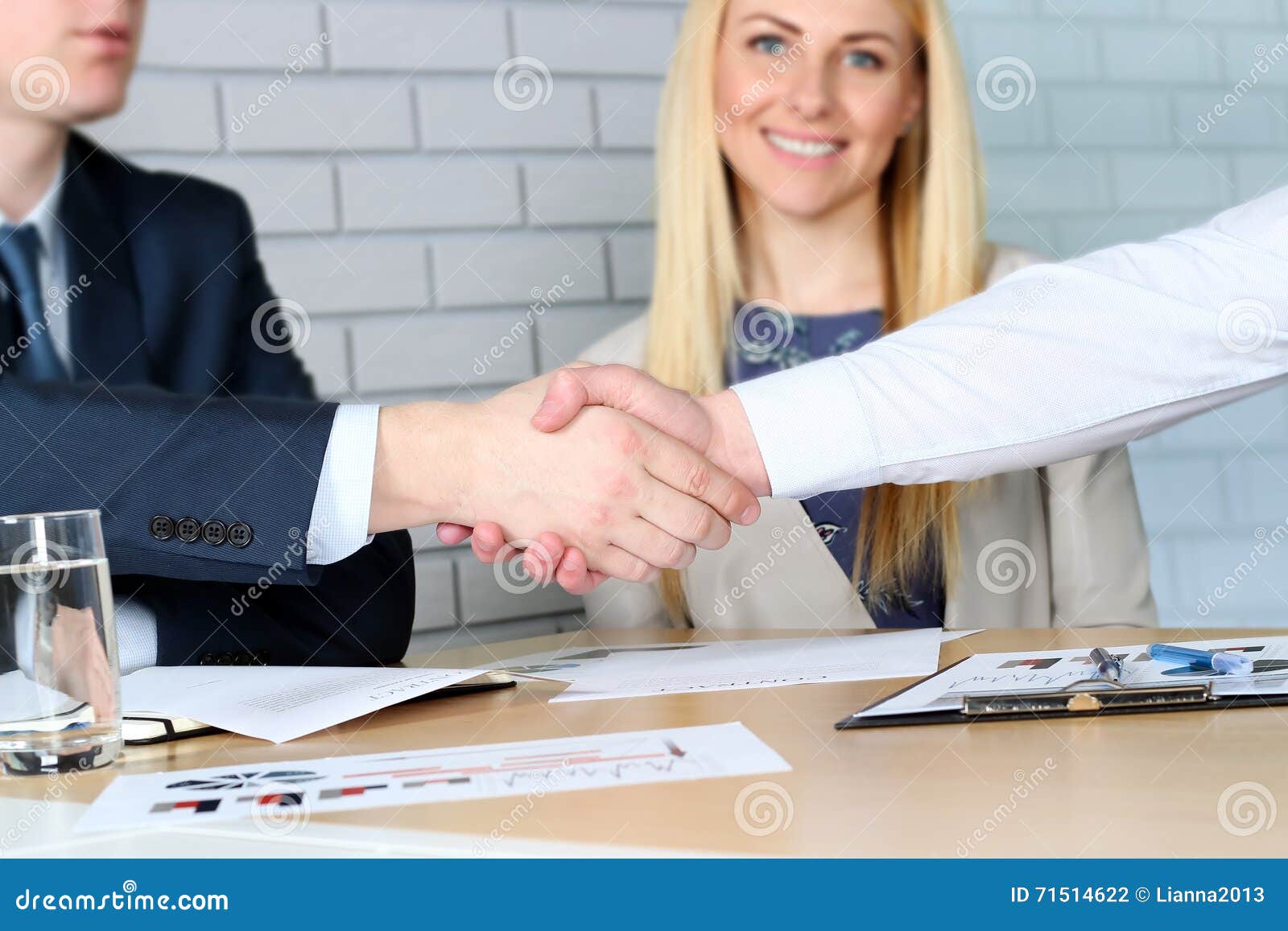 Close-up Image of a Firm Handshake between Two Colleagues after Signing ...