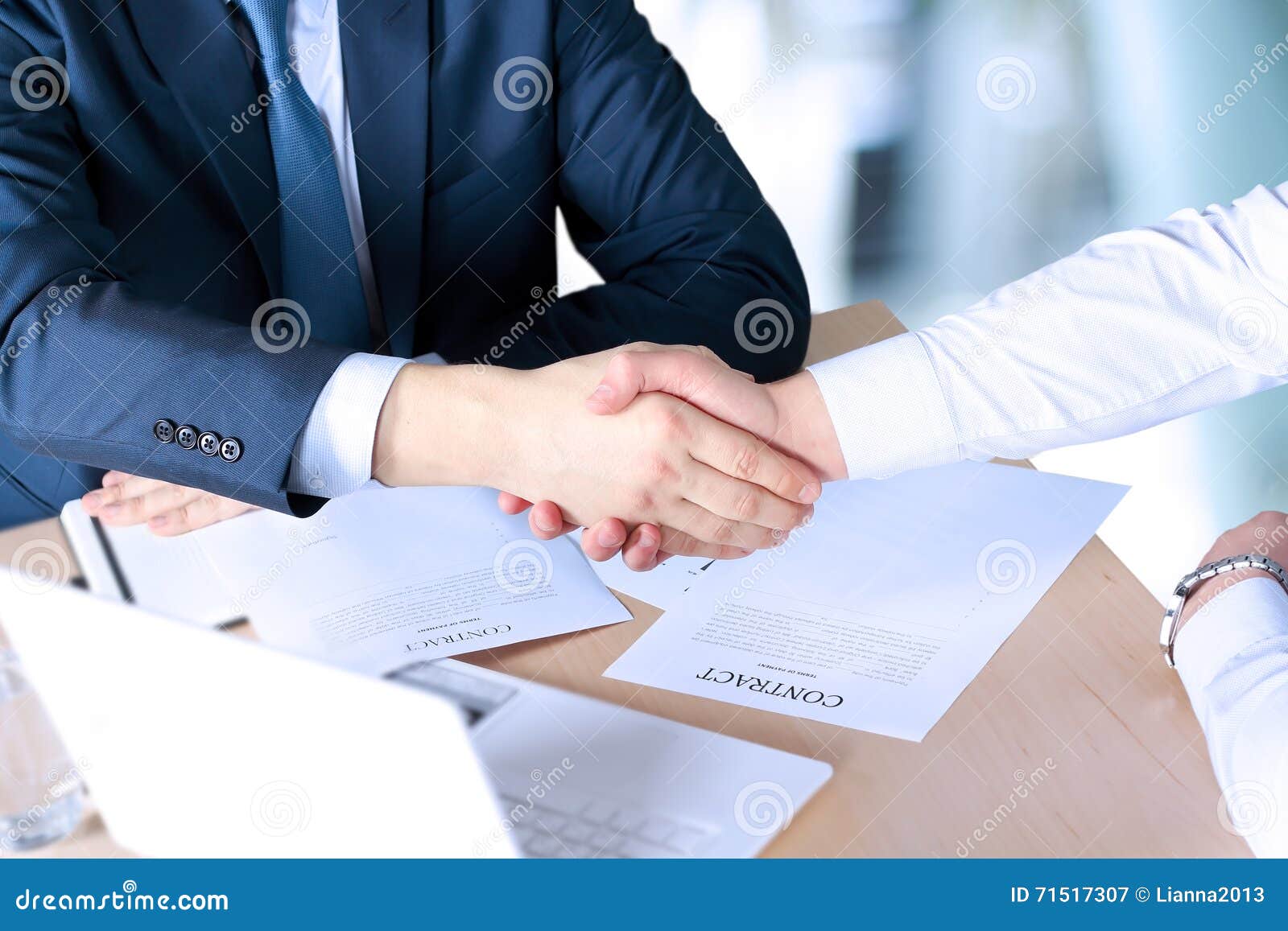 Close-up Image of a Firm Handshake between Two Colleagues after Signing ...