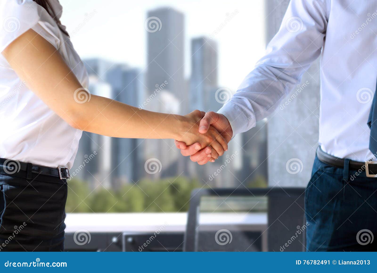 Close-up Image of a Firm Handshake between Two Colleagues after Signing ...