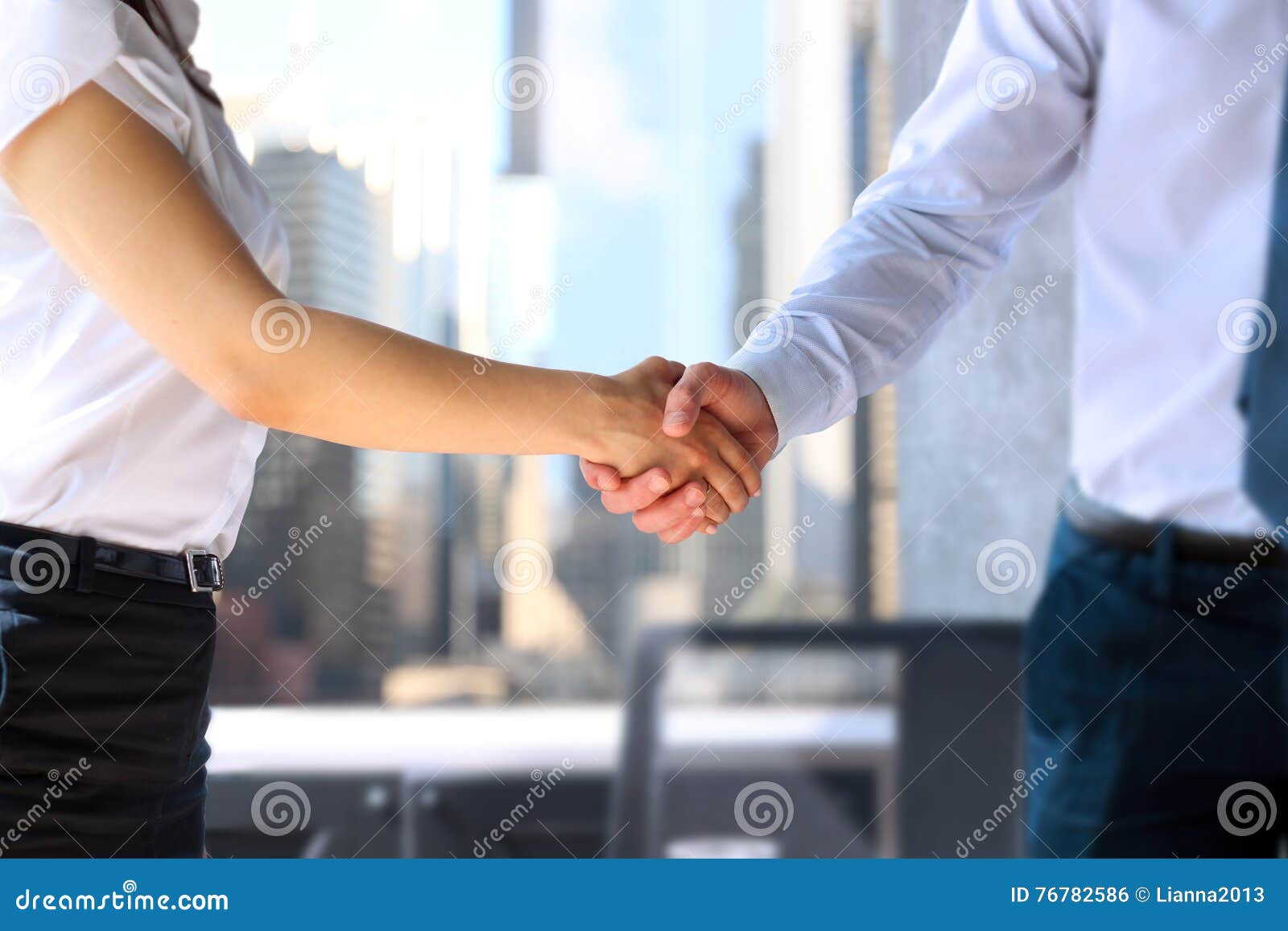 Close-up Image of a Firm Handshake between Two Colleagues after Signing ...