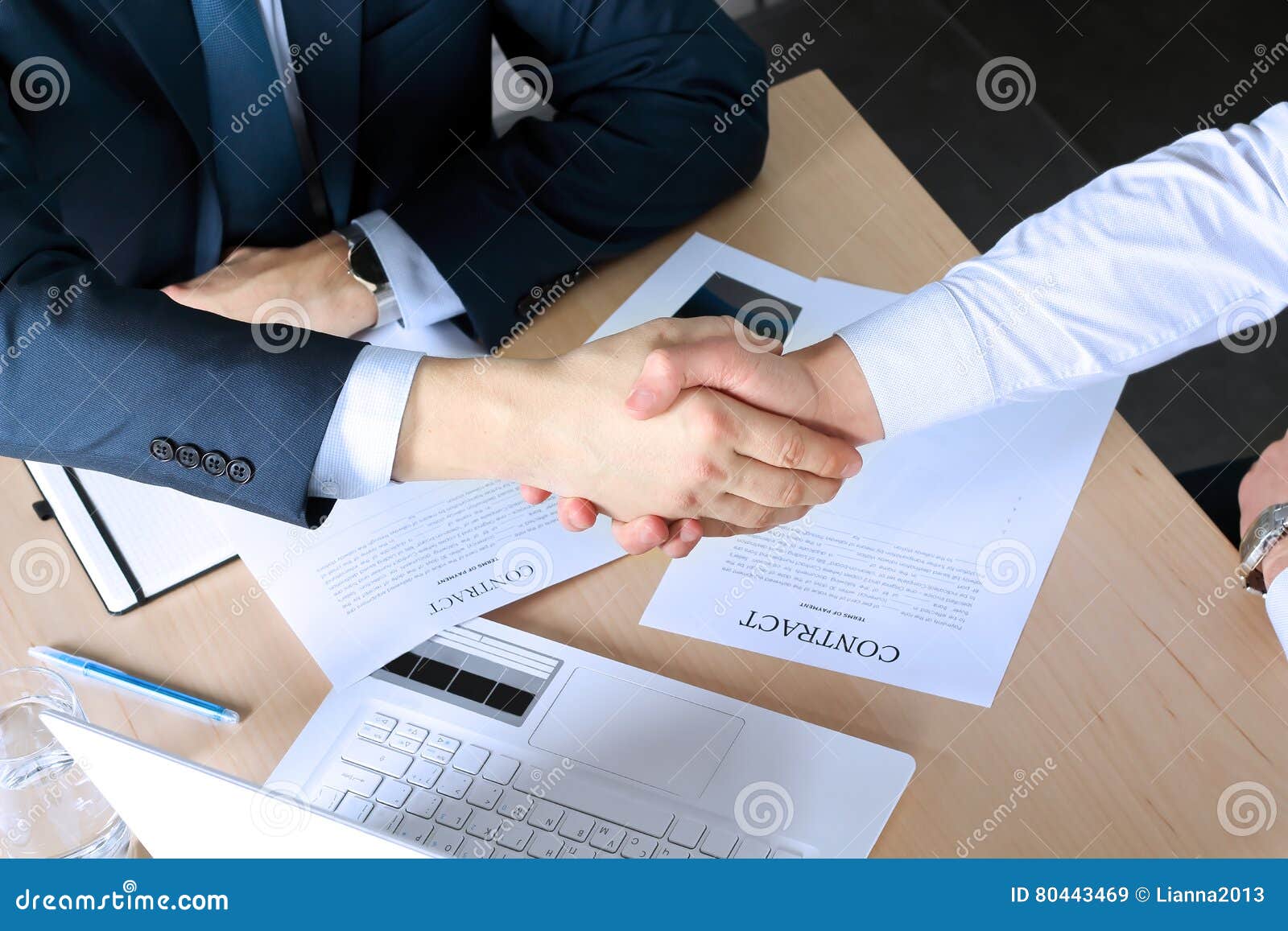 Close-up Image of a Firm Handshake between Two Colleagues after Signing ...