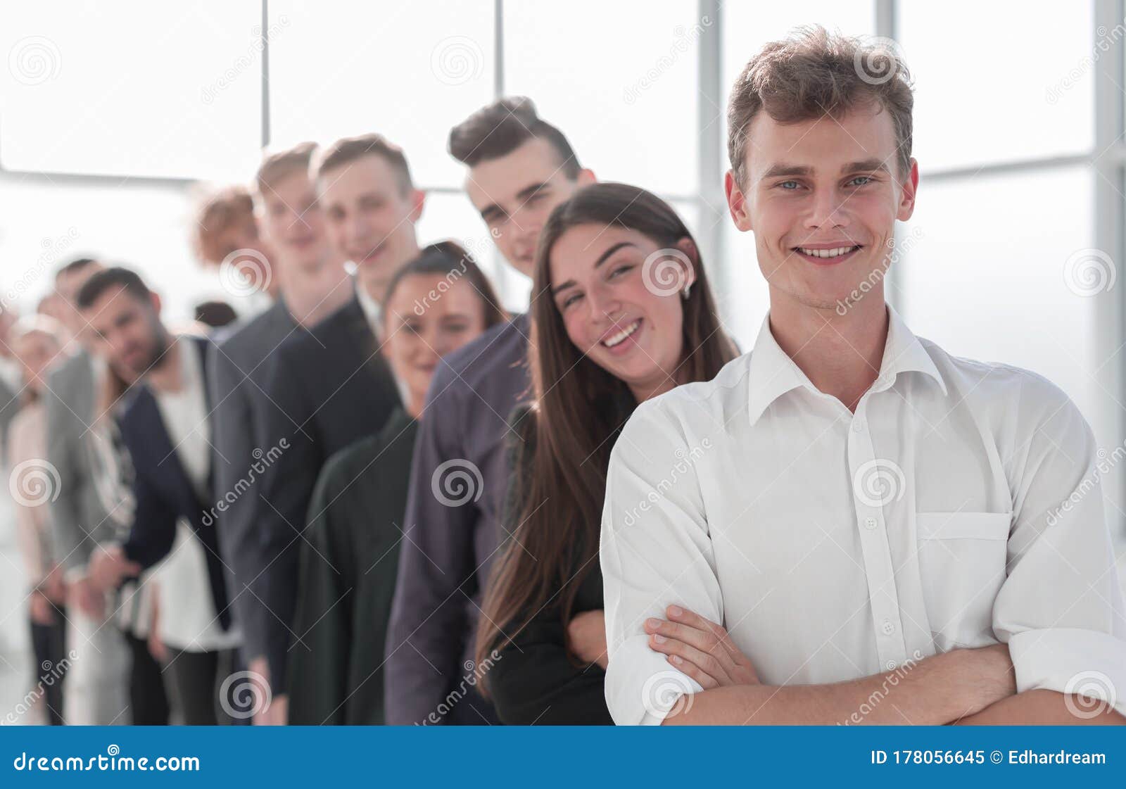 Image of a Group of Young People Standing in a Queue Stock Image ...