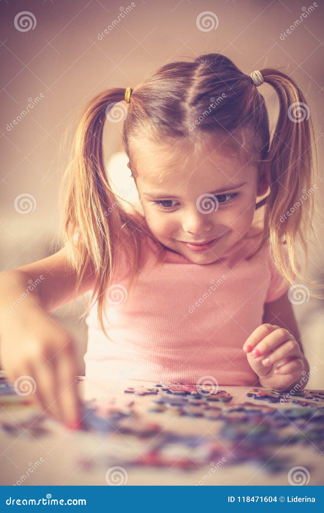Close Up Image of Little Girl Playing with Puzzles. Stock Photo - Image ...