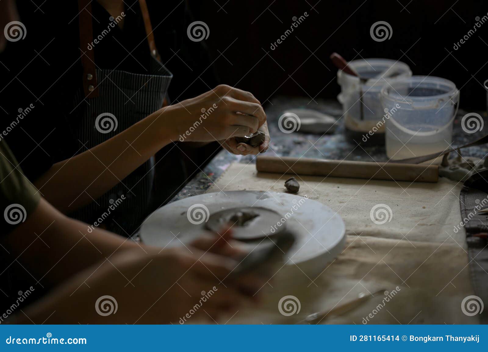 Close-up Image of a Man in a Clay Sculpture Workshop, Molding Raw Clay ...