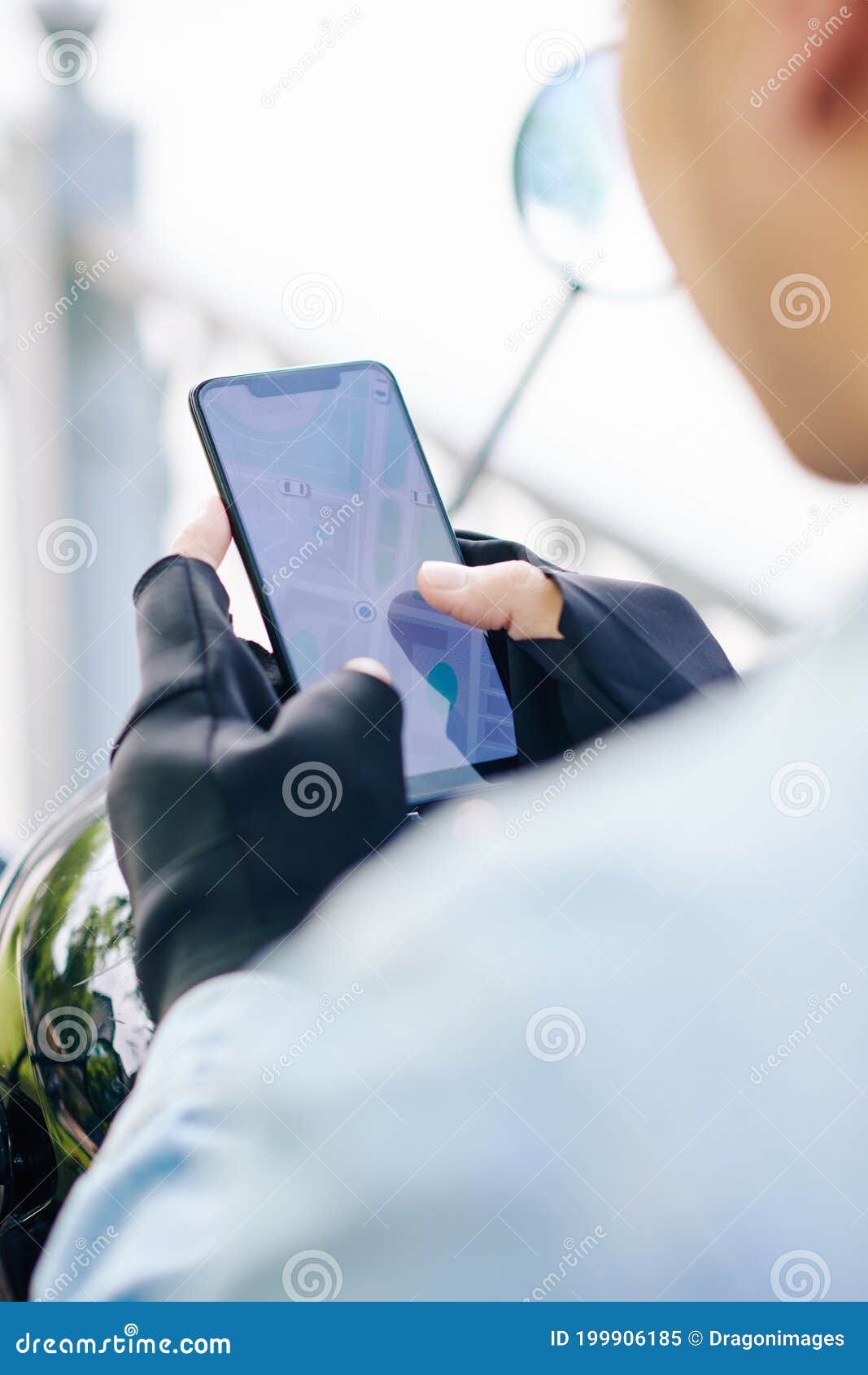 Motorcyclist checking map stock image. Image of application - 199906185