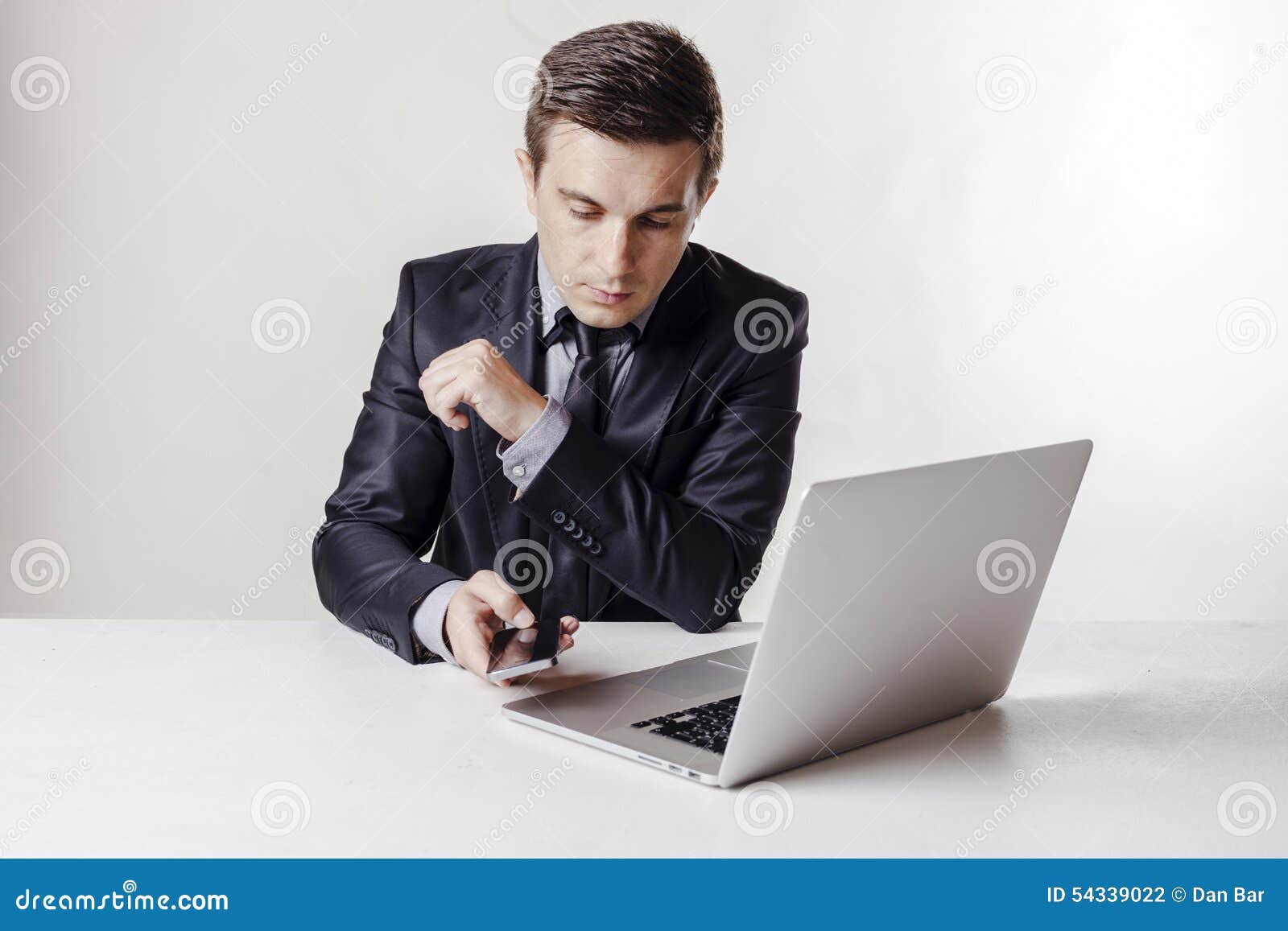 Close Up Image of Multitasking Business Man Using a Laptop and Mobile ...