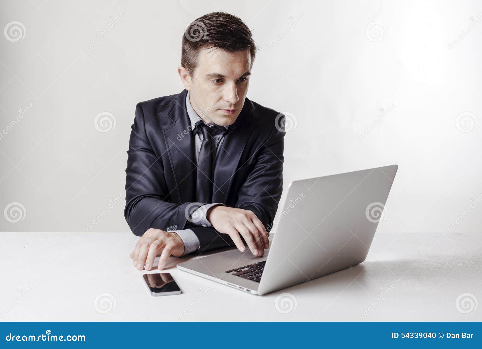 Close Up Image of Multitasking Business Man Using a Laptop and Mobile ...