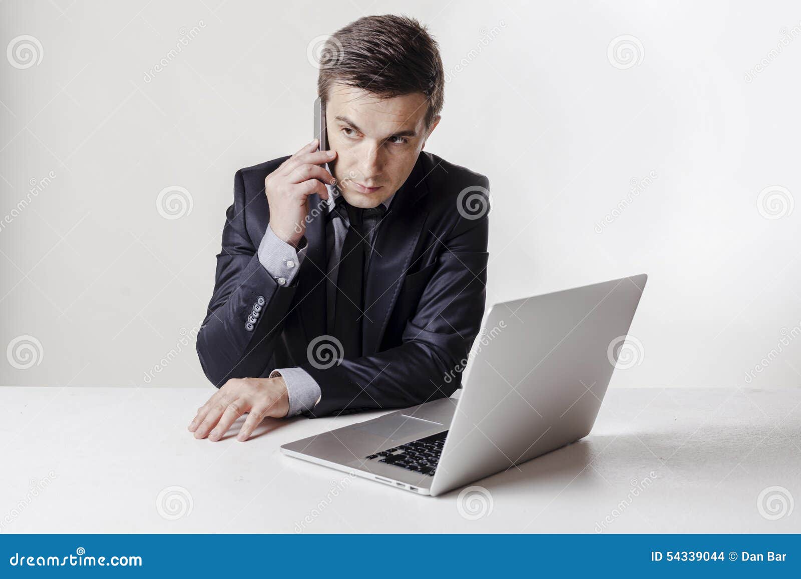 Close Up Image of Multitasking Business Man Using a Laptop and Mobile ...