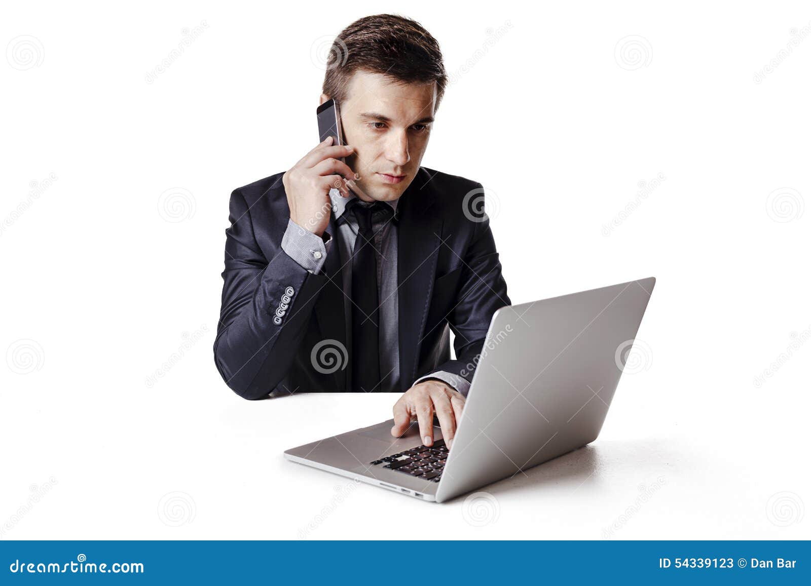 Close Up Image of Multitasking Business Man Using a Laptop and Mobile ...