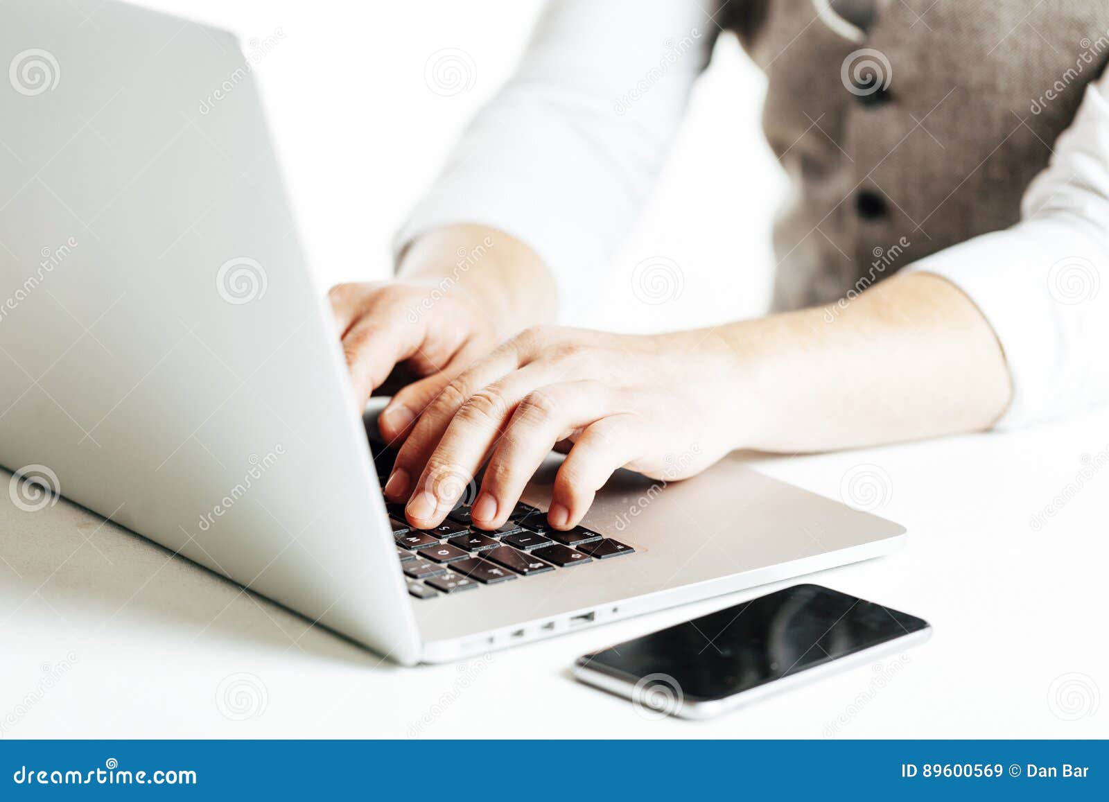 Close Up Image of Multitasking Business Man Using a Laptop and Mobile ...
