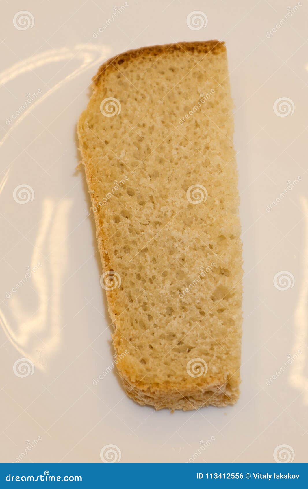 Close-up Image of One Slice of White Bread Against the White Background ... Close-up Image of One Slice of White Bread Against the White Background ...