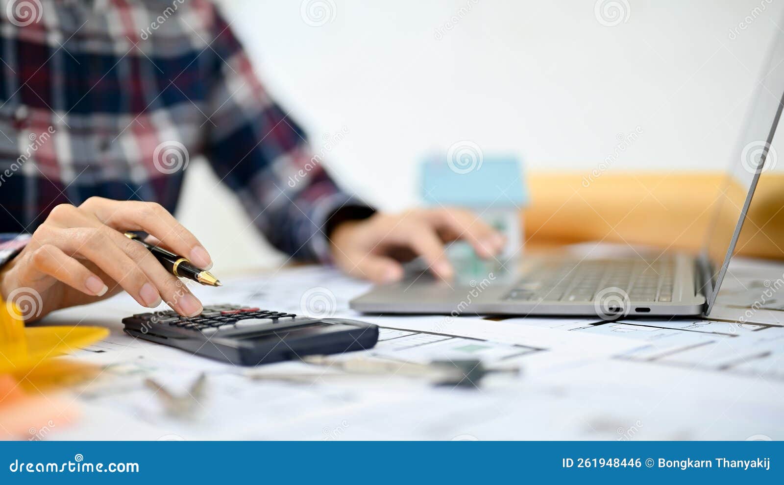 Asian Female Architect or Engineer Using Scientific Calculator and ...