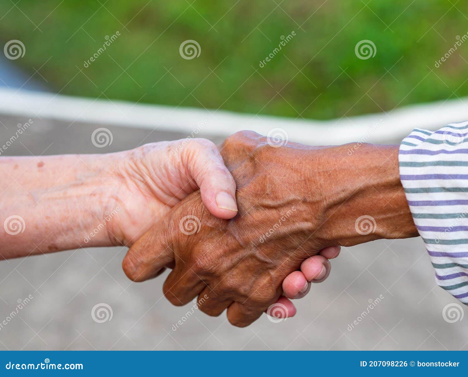 Close-up Image of Shaking Hands between Elderly Women. Unity Concept ...
