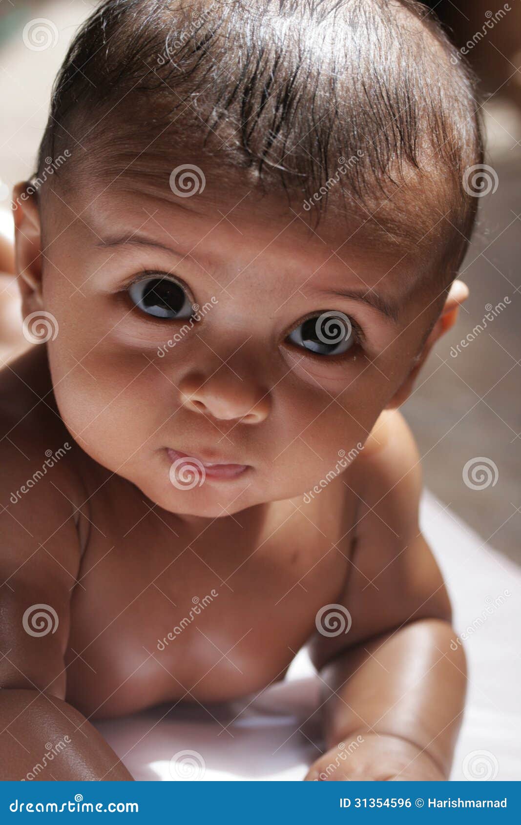 A Close Up Image of a Small Male Baby with Big Eyes Looking Stock Photo ...