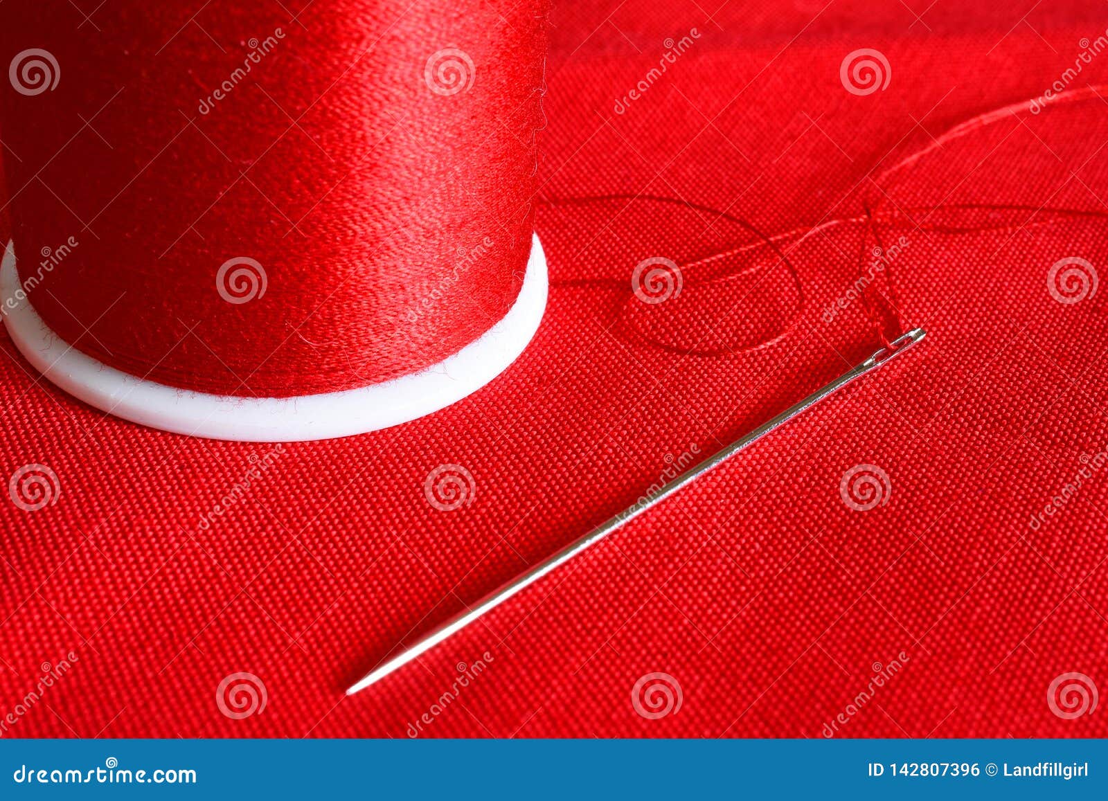 Red Thread and Sewing Needle Stock Photo - Image of satin, luxury ...