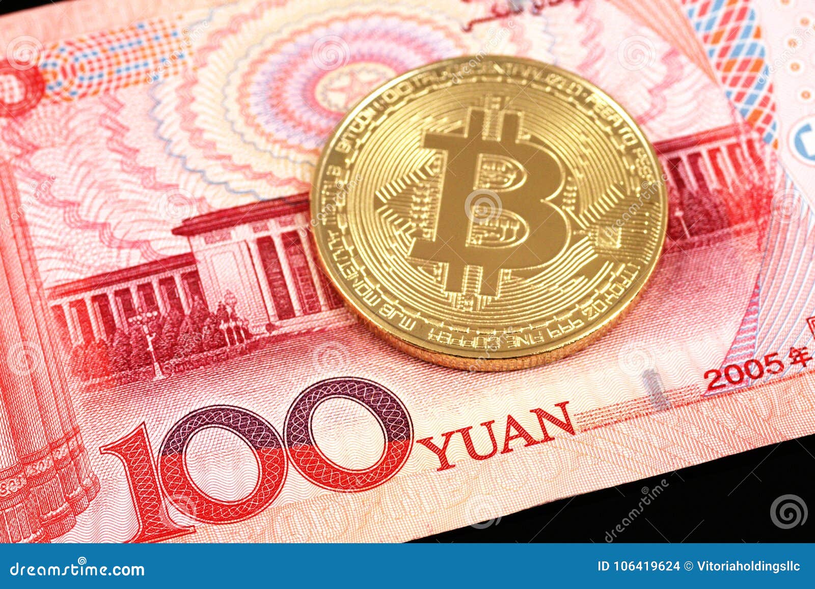 A Physical Bitcoin Close Up with a Chinese 100 Yuan Note Stock Photo ...