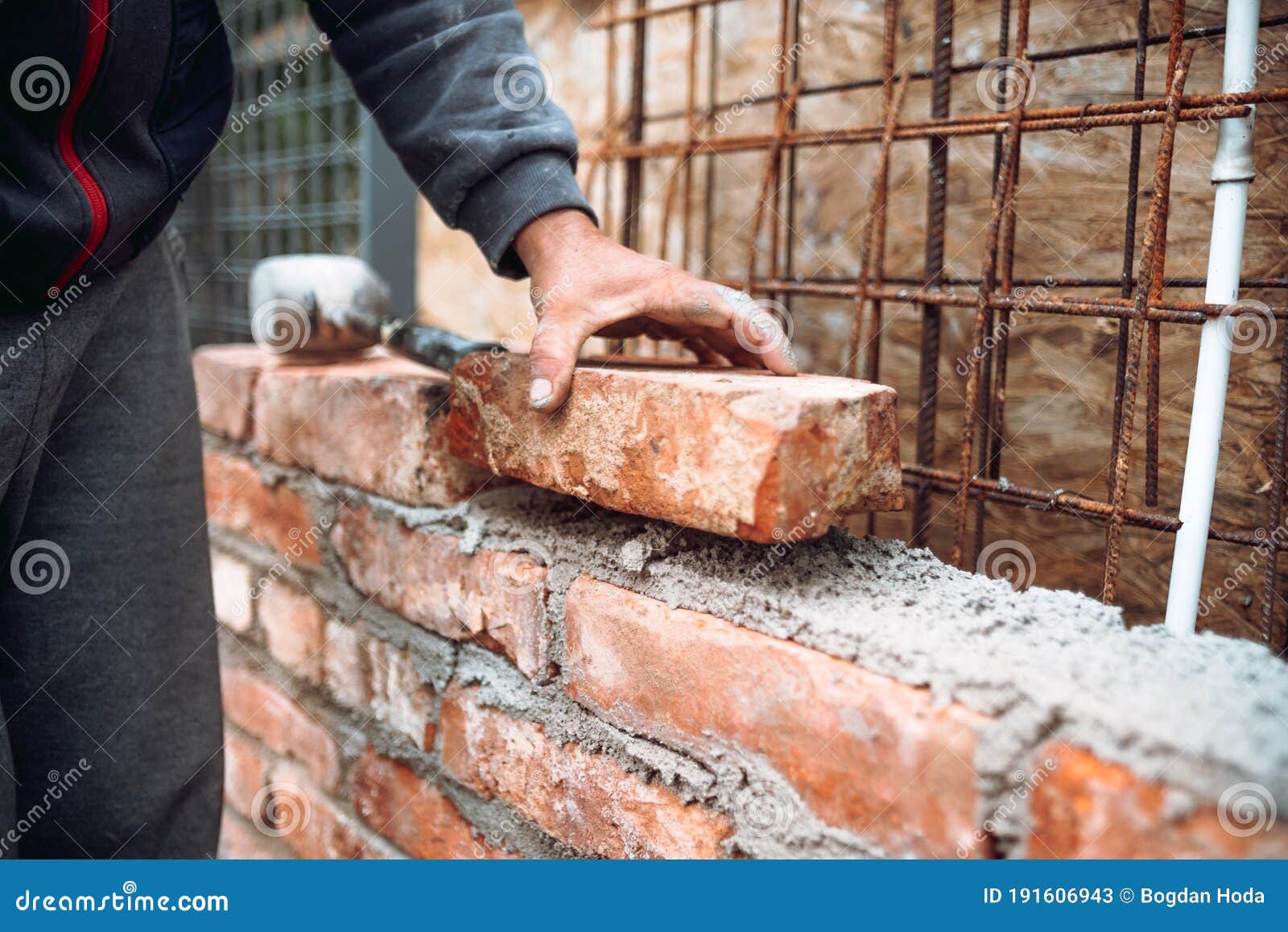 Close Up of Industrial Bricklayer Installing Bricks on Construction ...