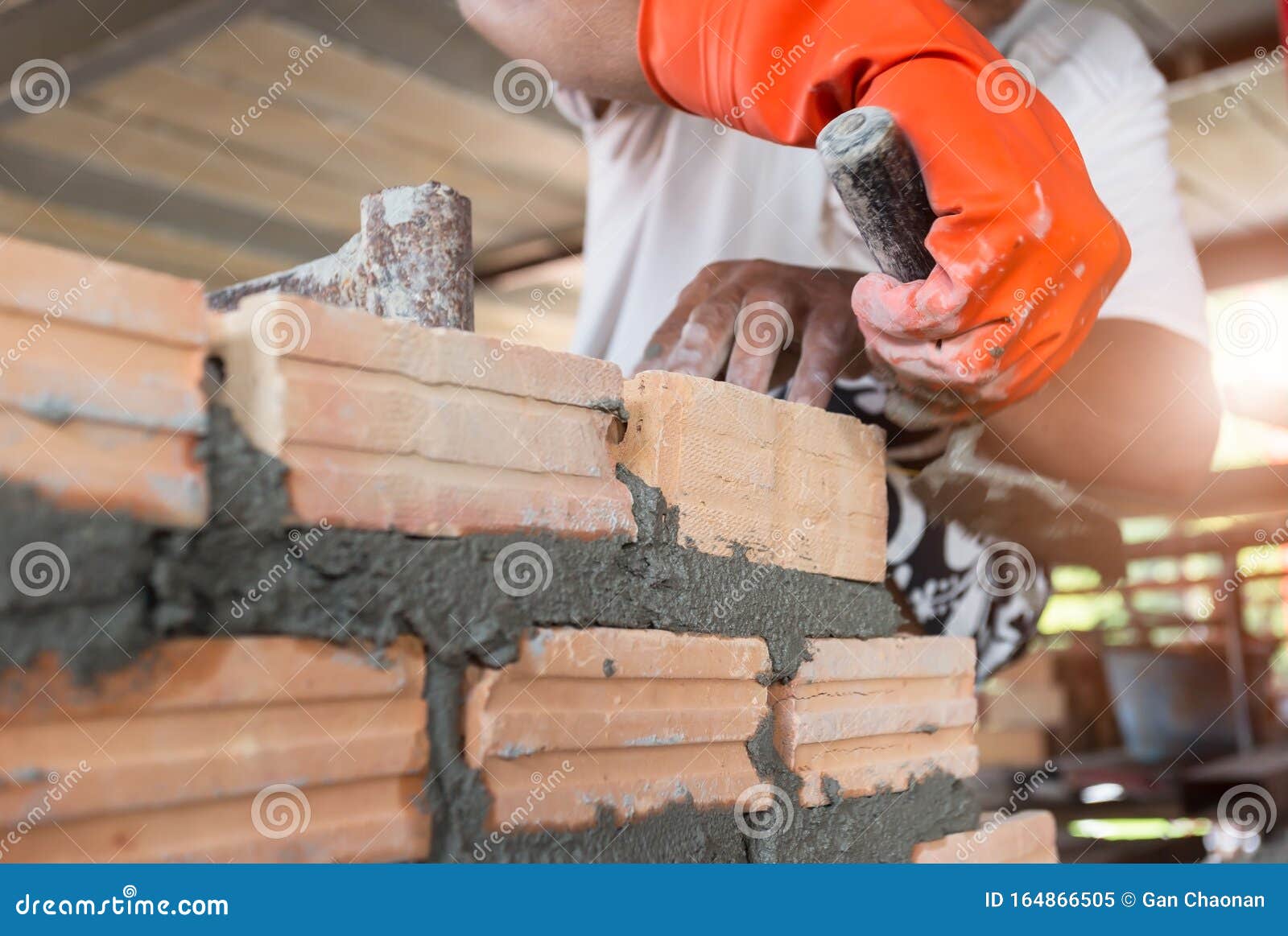 Mechanic`s Hand Holding Bricks in Construction Projects Stock Image ...