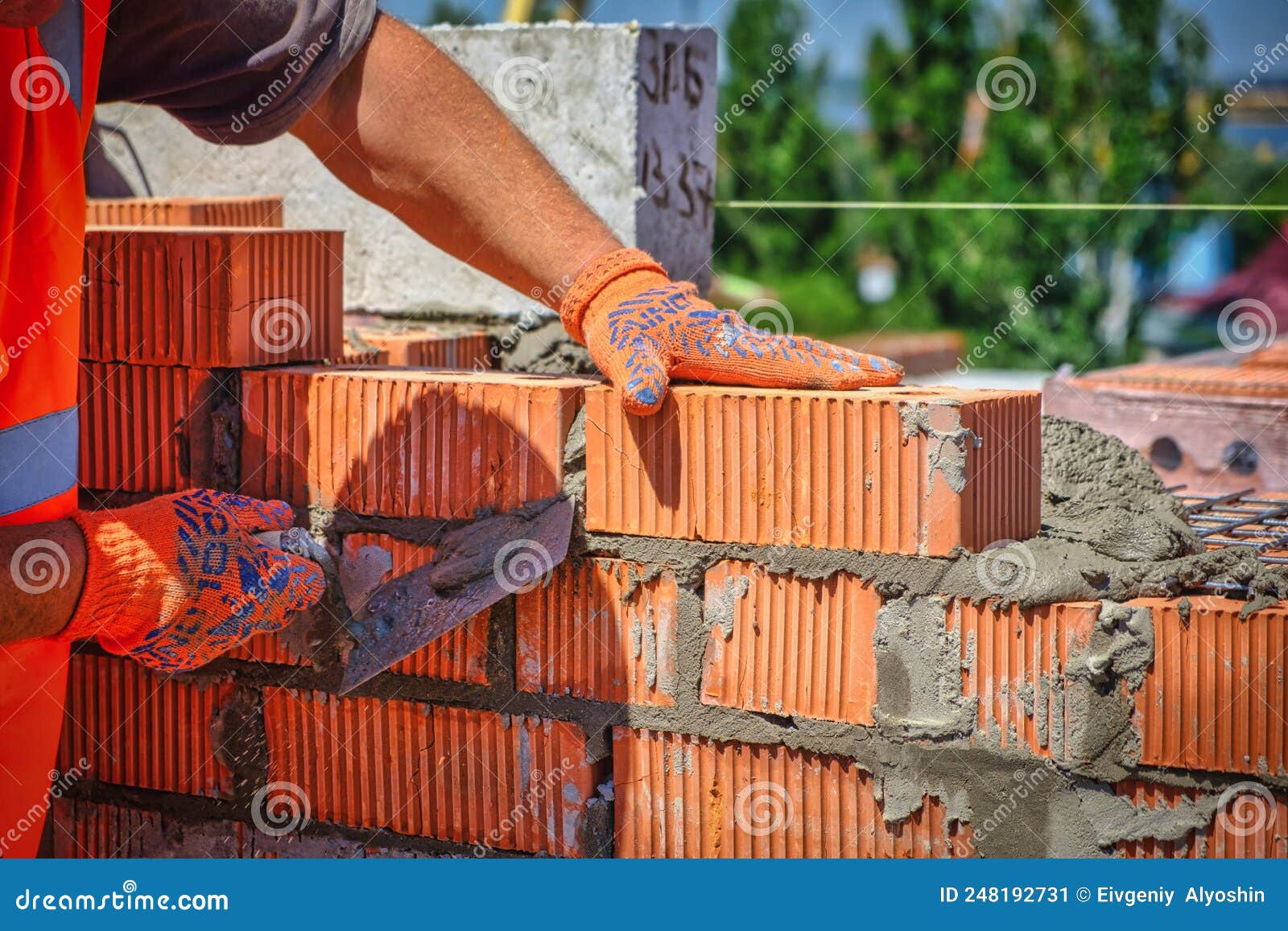 Close Up of Industrial Bricklayer Installing Bricks on Construction ...