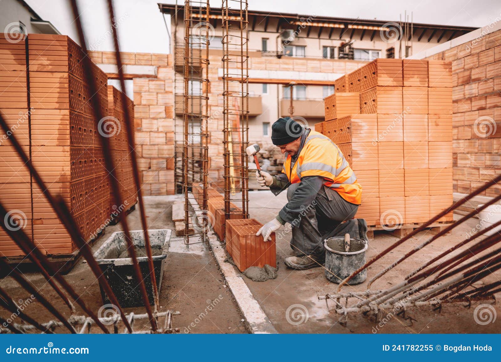 Close-up Bricklayer Builder Using The Water Level, Check The ...