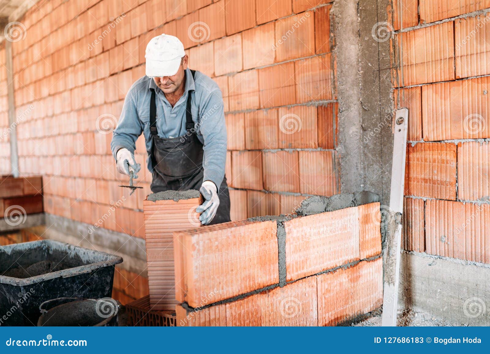 Close Up of Industrial Worker, Bricklayer Installing Bricks on Interior ...